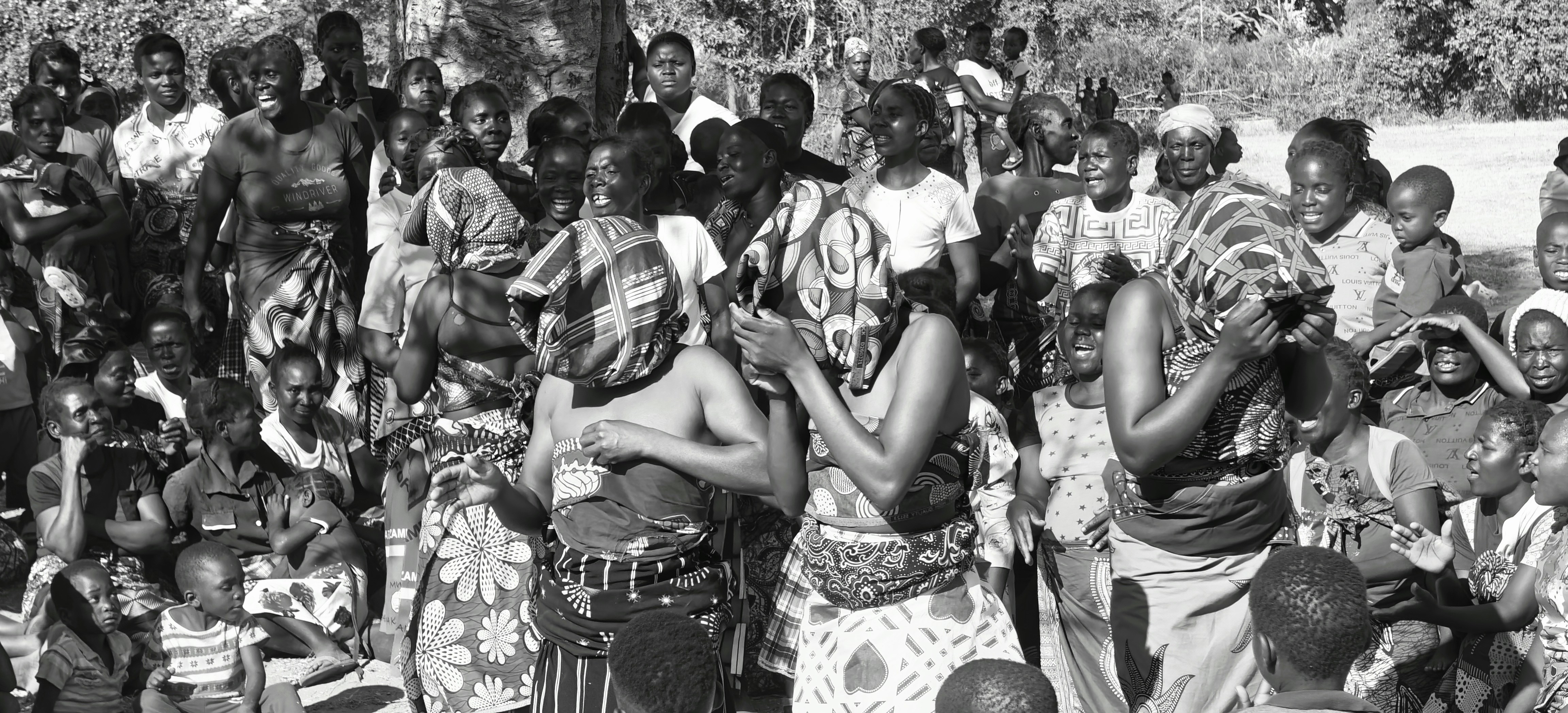 Faces in the Circle: A Shared Moment Amid a Midnight Crowd