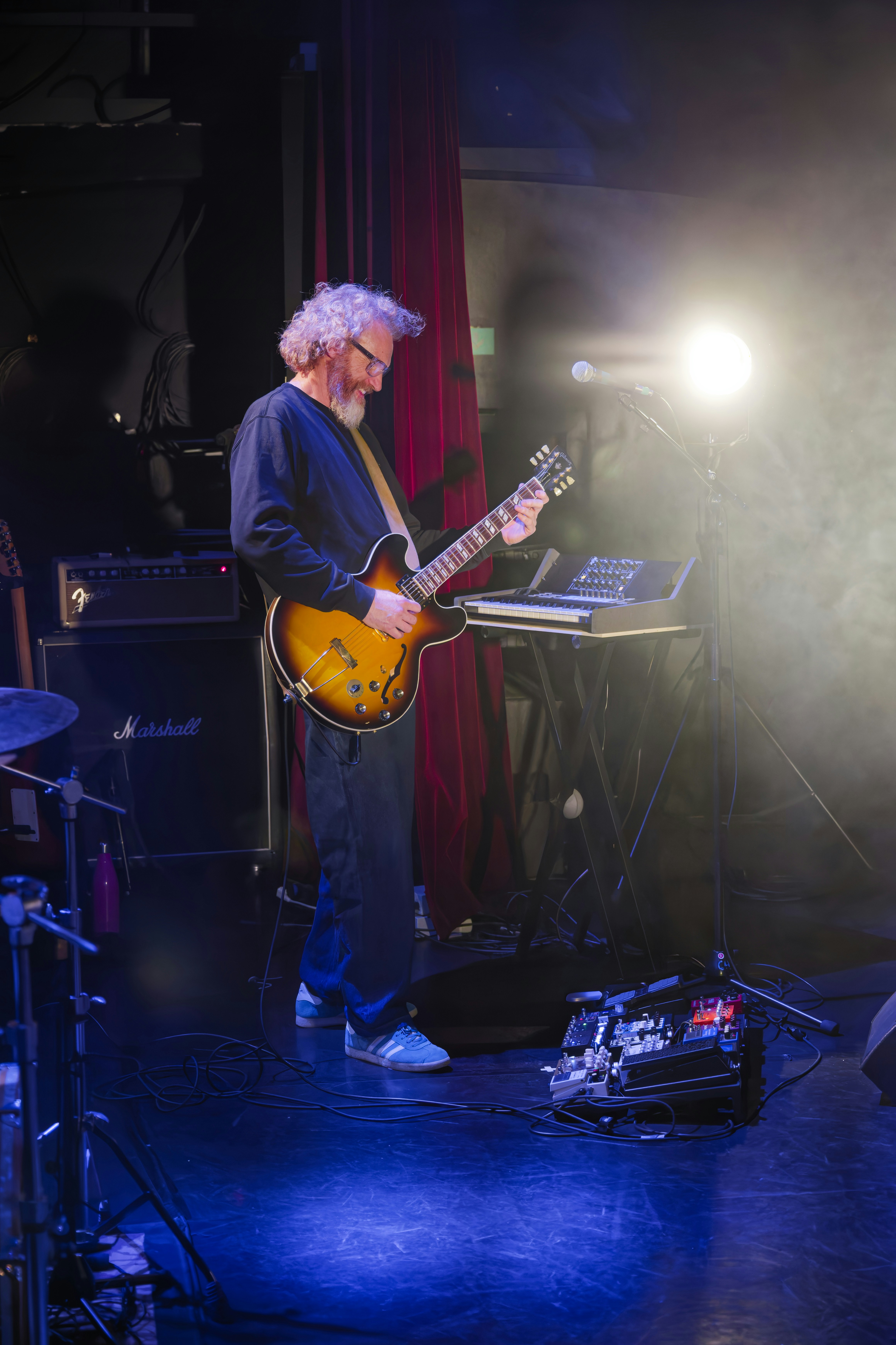 Guitarist in the Spotlight: Warm Tones and Neon Smoke