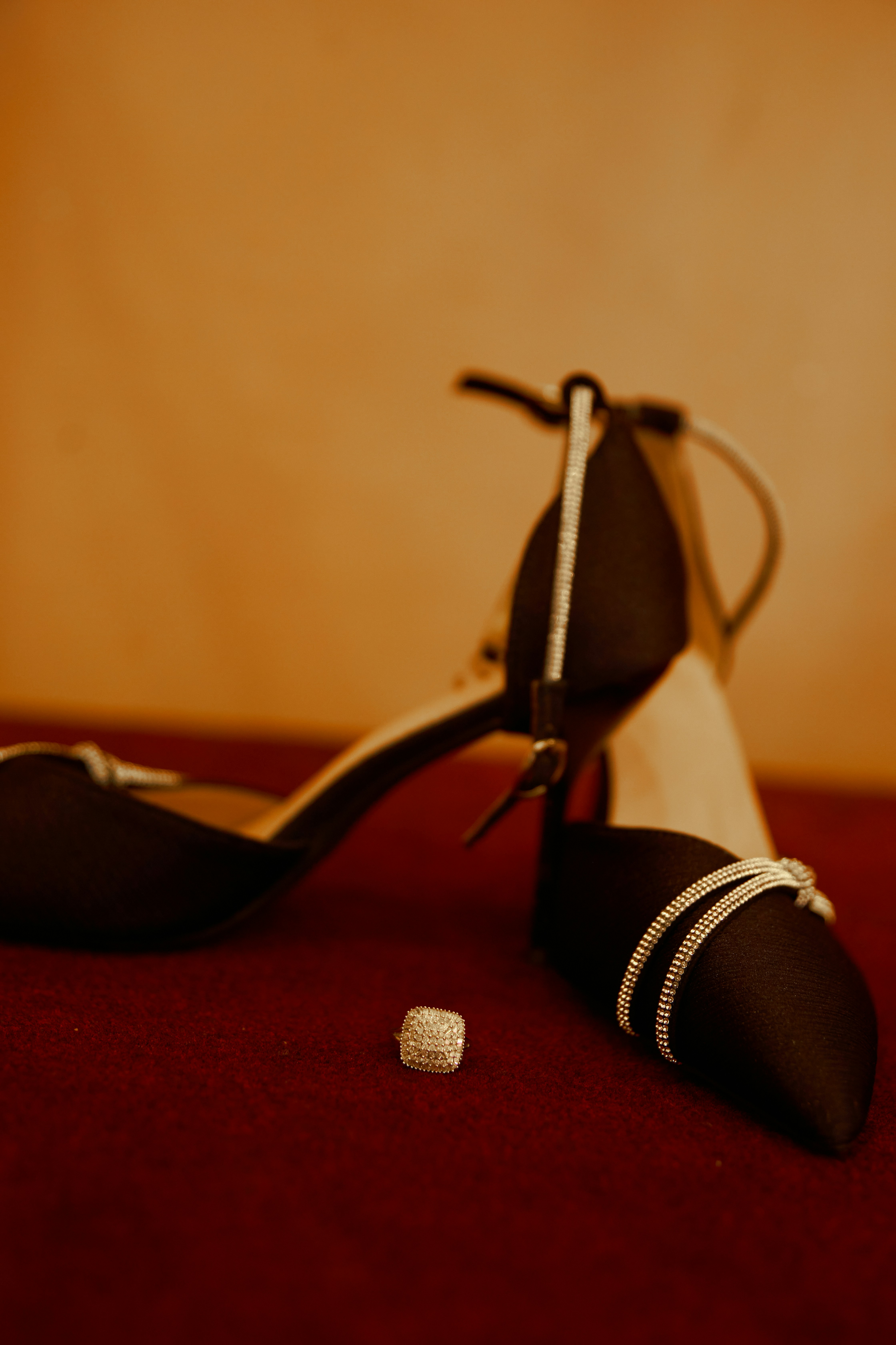 A Single Sparkle: The Ring and Heel in Quiet Scarlet