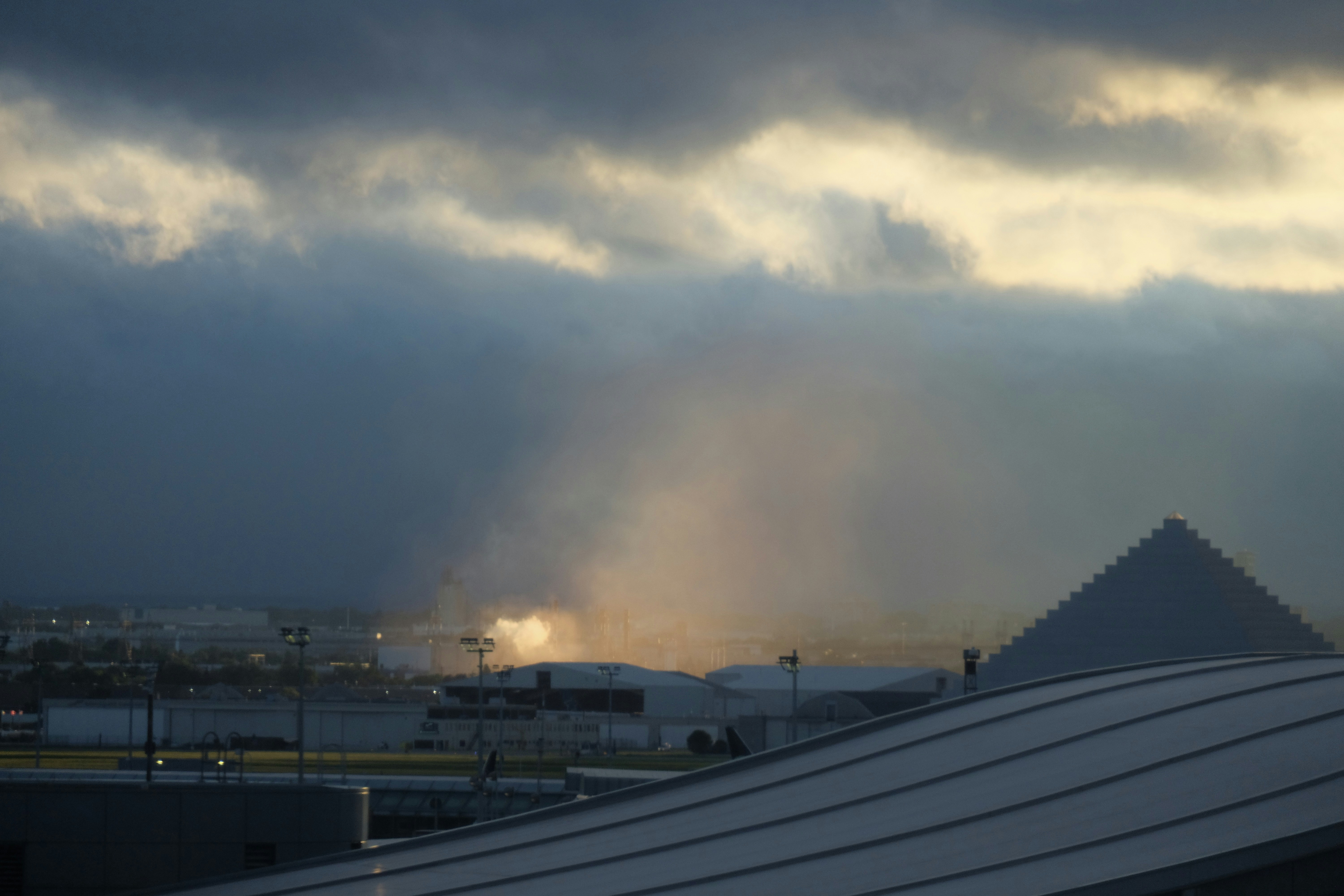 Rising Diesel Fume over an Industrial Complex at Dusk