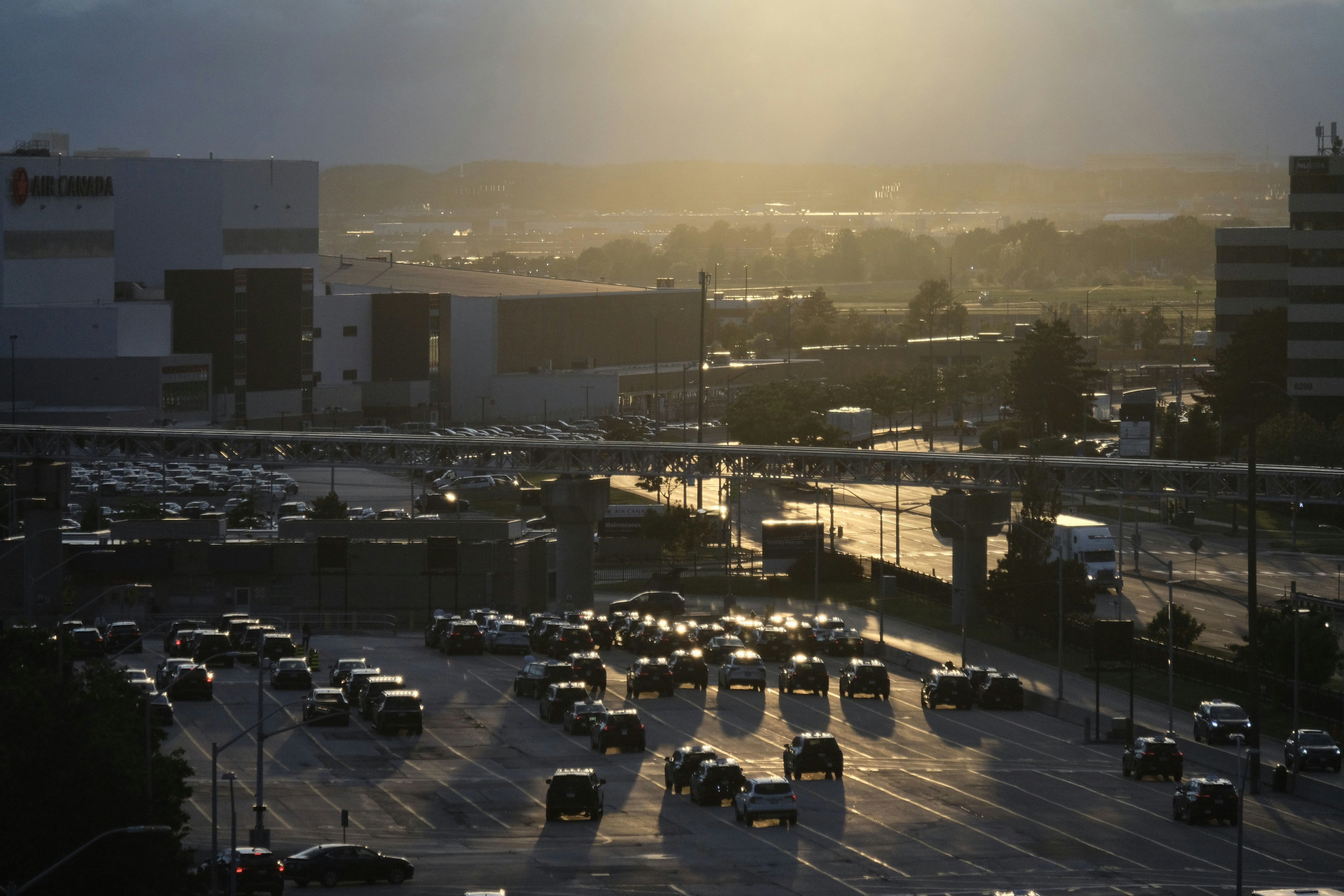 Golden Hour Grid: Traffic Streams beneath a Distant Horizon