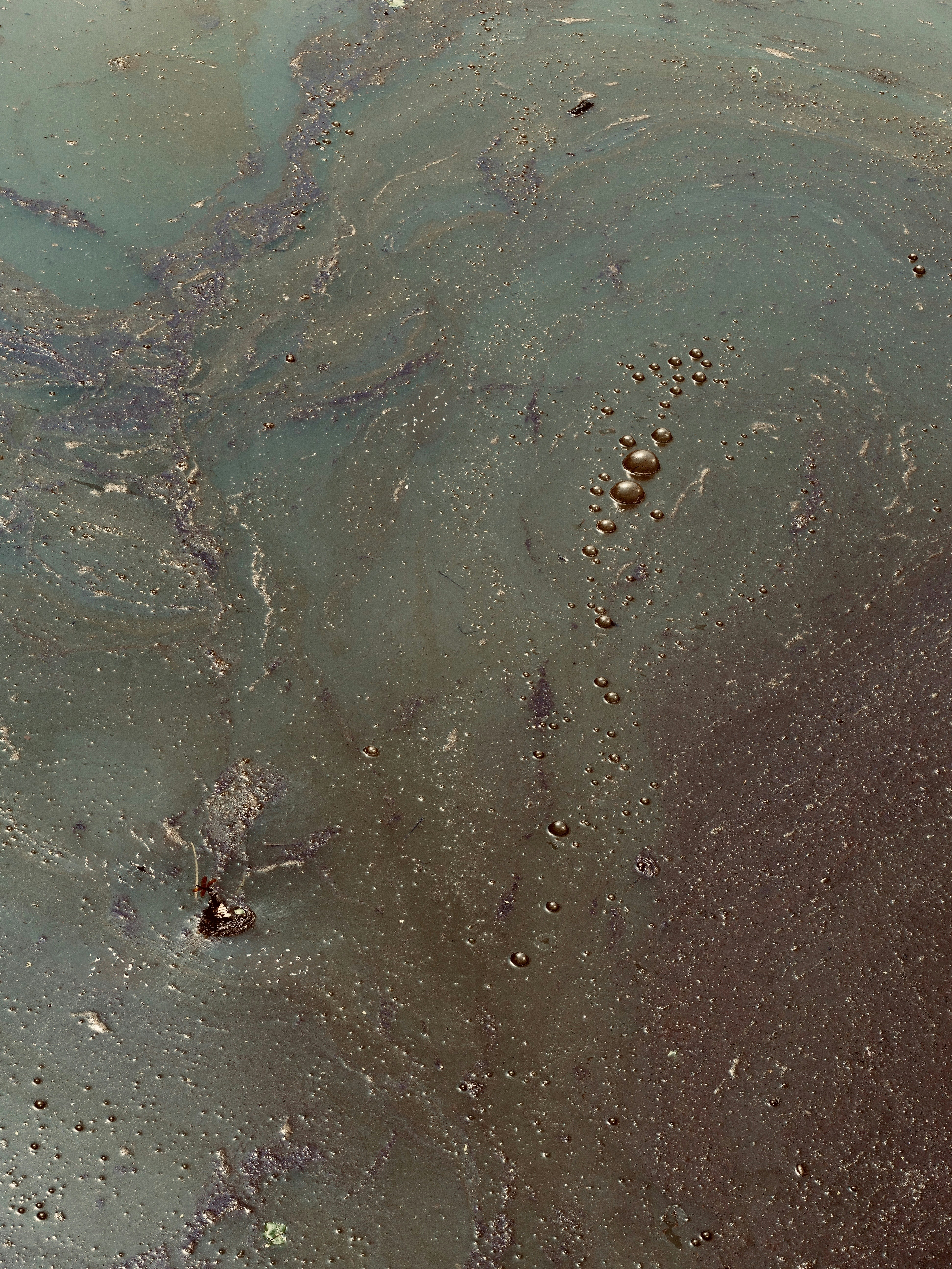 Liquid Abstract: Iridescent Swirls and Pebble Trails