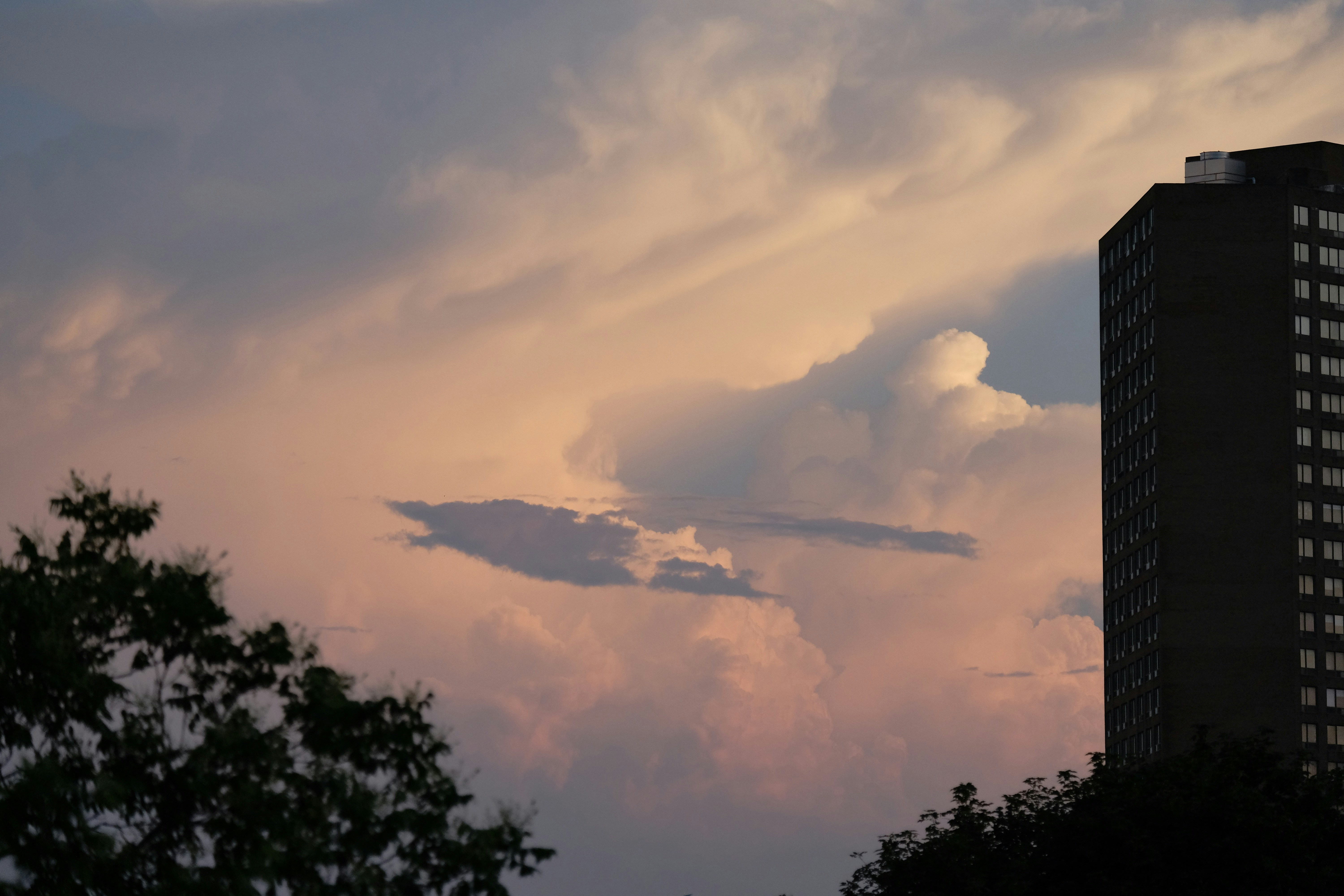 Sunset Sky Behind a Silhouette: Tower and Trees