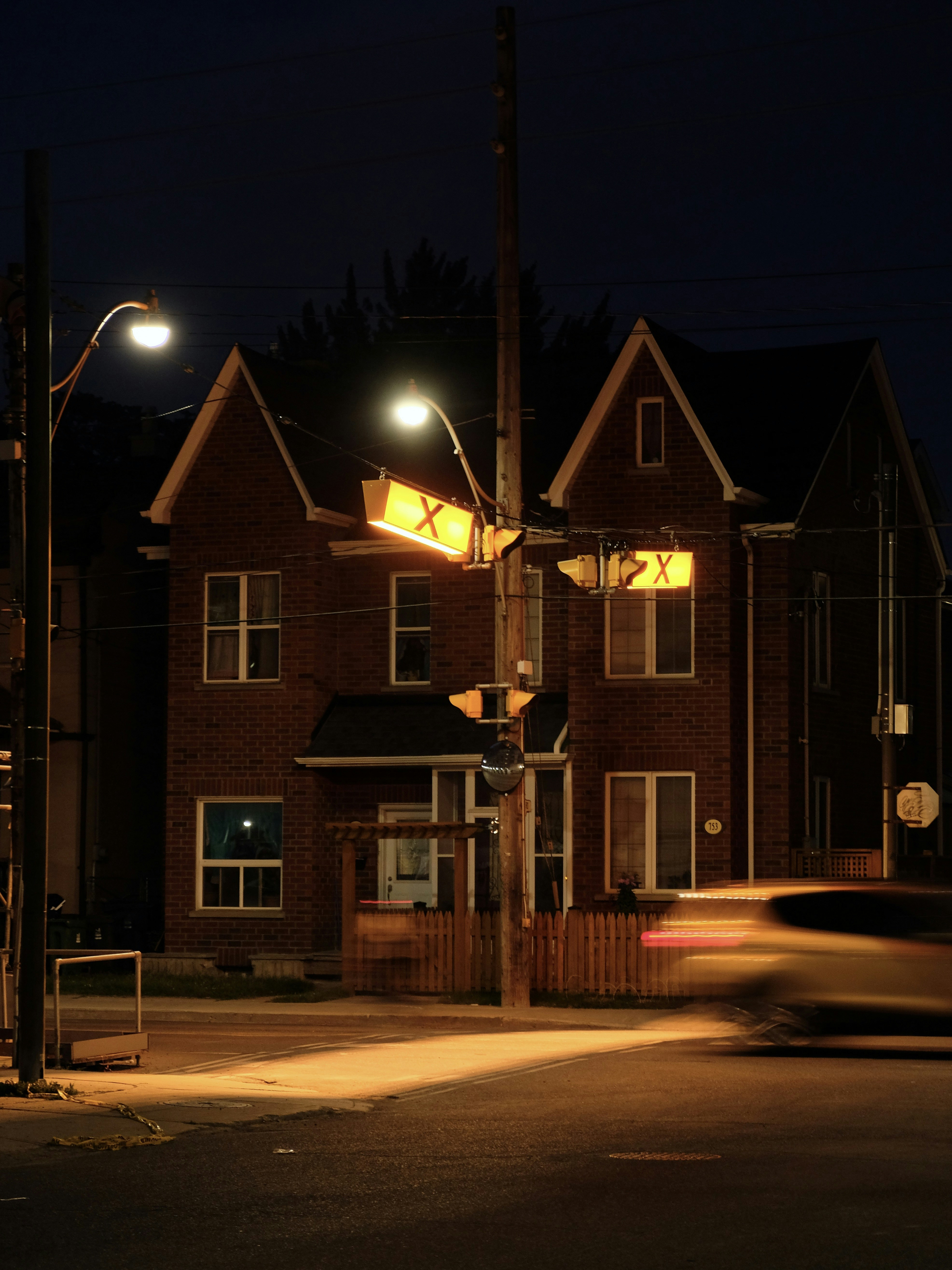 Night at the Crossing: A Glowing X Marks the Quiet Street