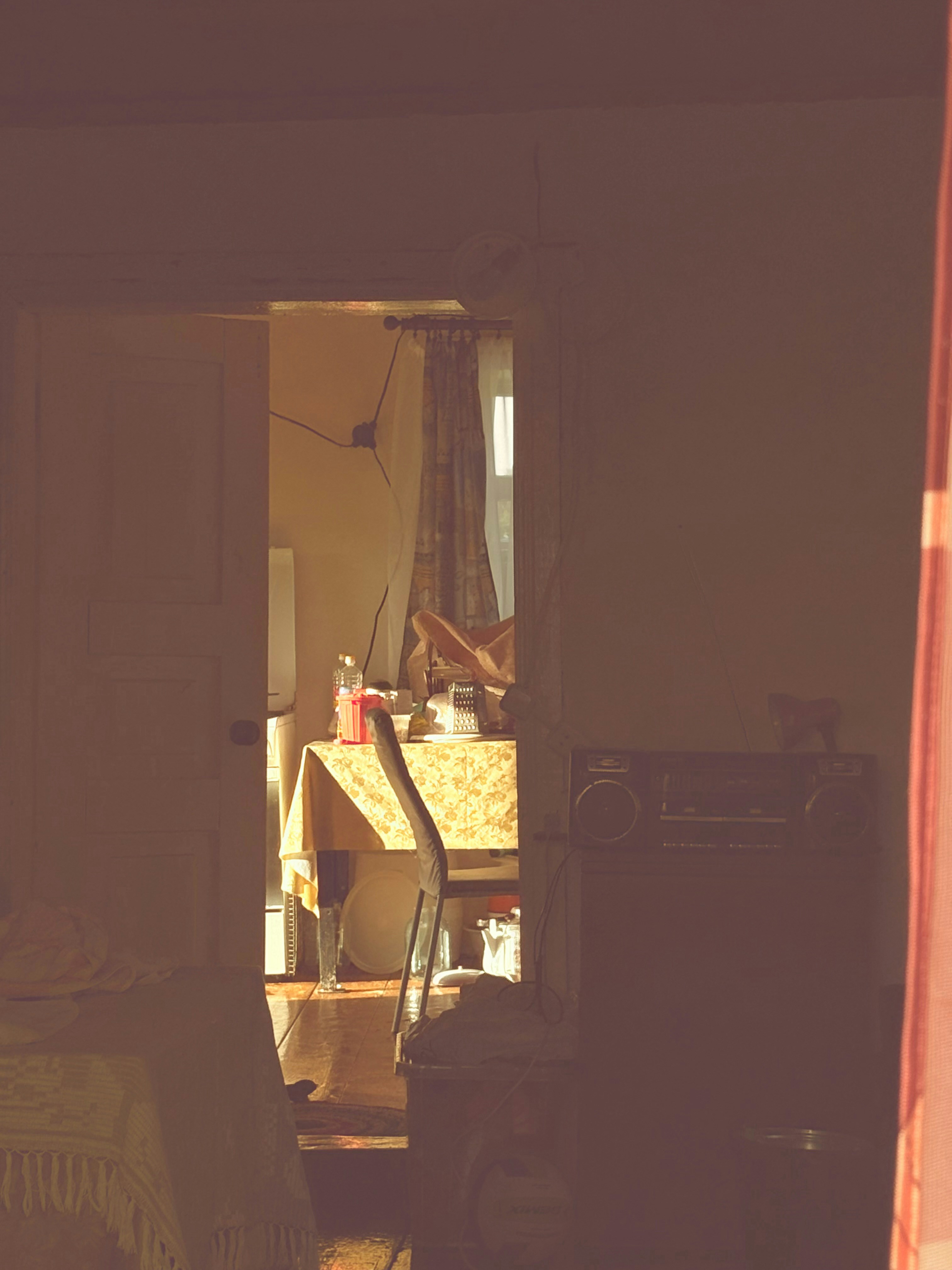 Quiet Through the Doorway: A Domestic Corner with Subtle Echoes