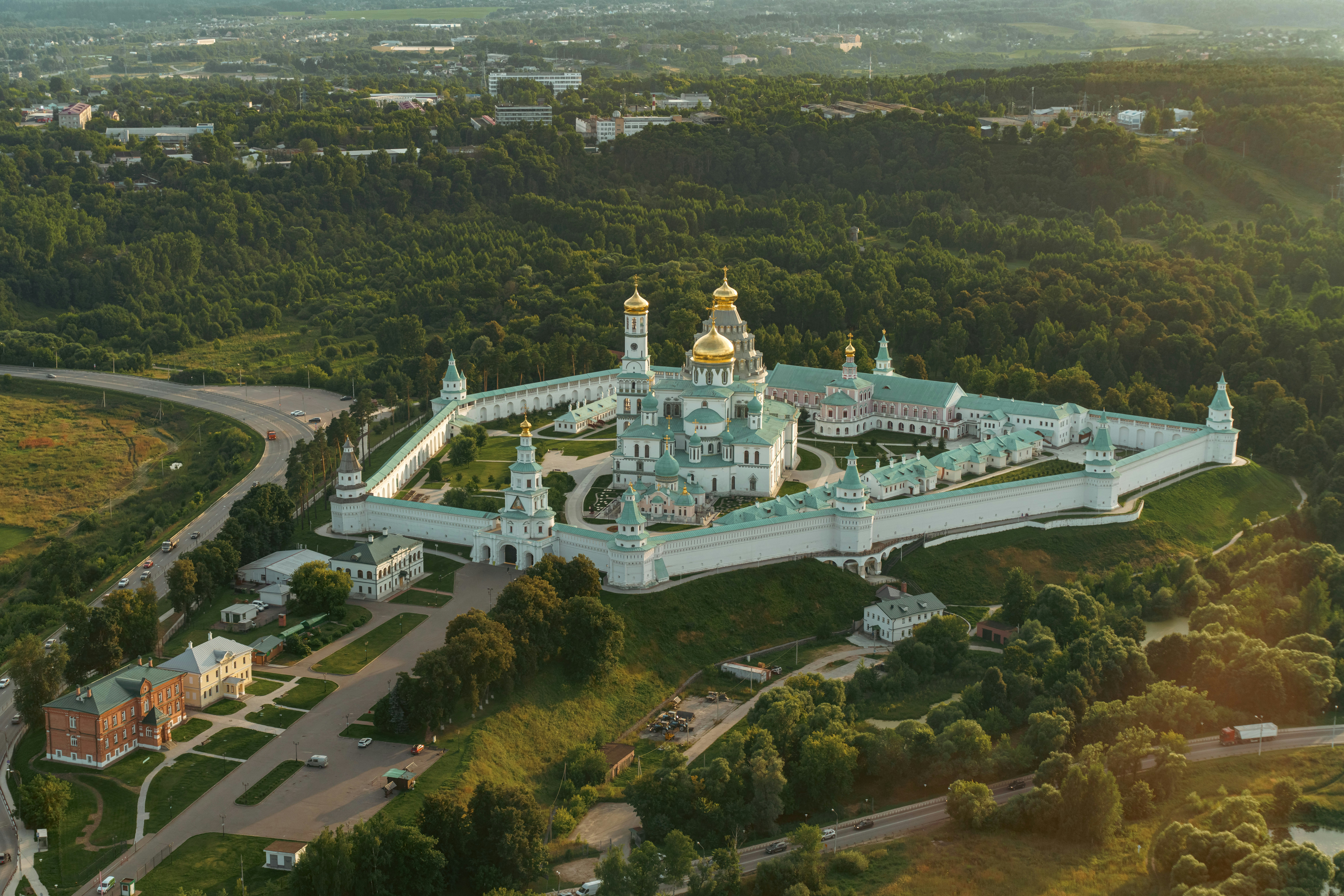 Elysian Fortress: Aerial Glow Over a Serene Monastic Complex