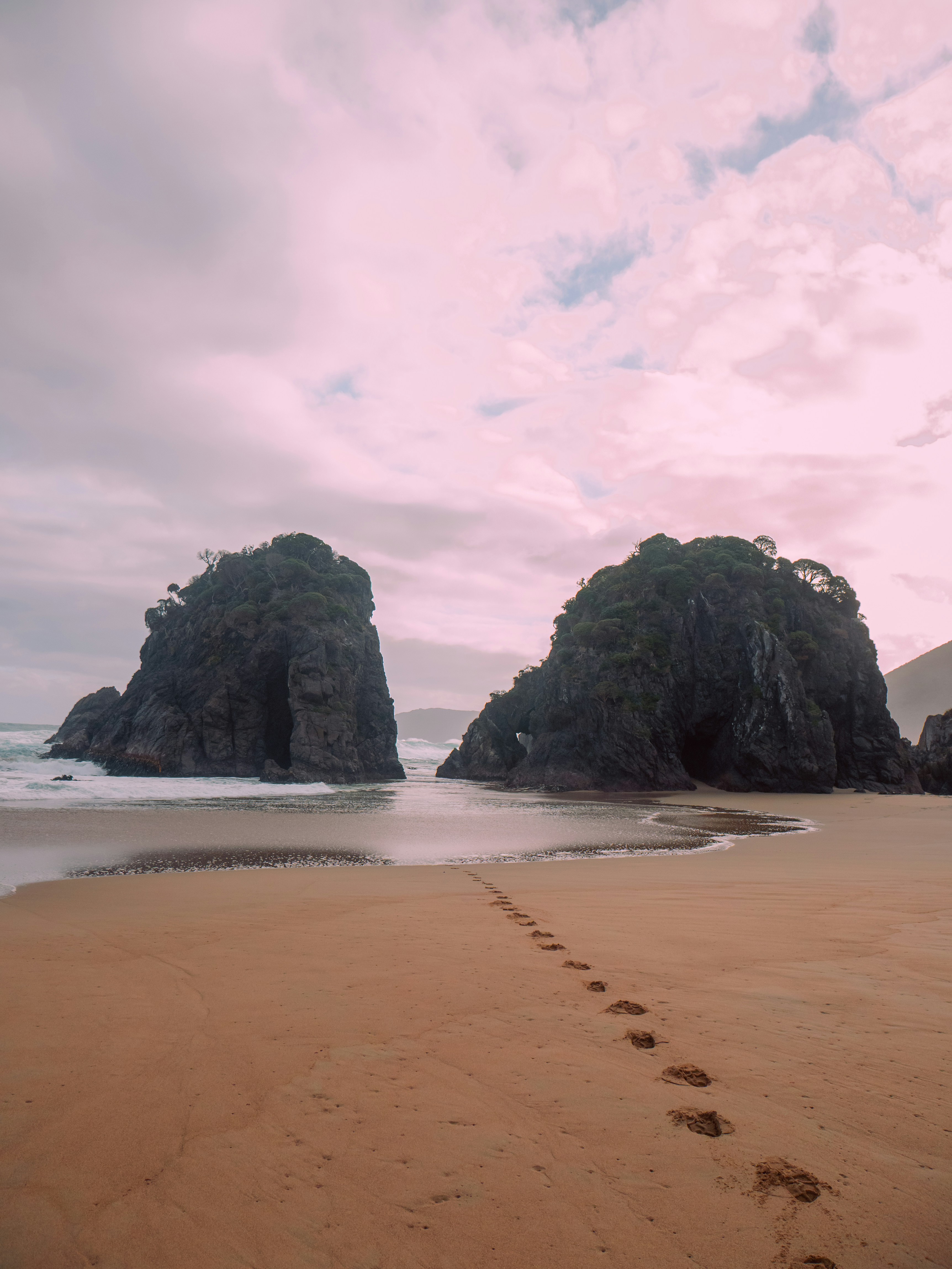 Footprints Toward the Sea Between Twin Sea Stacks