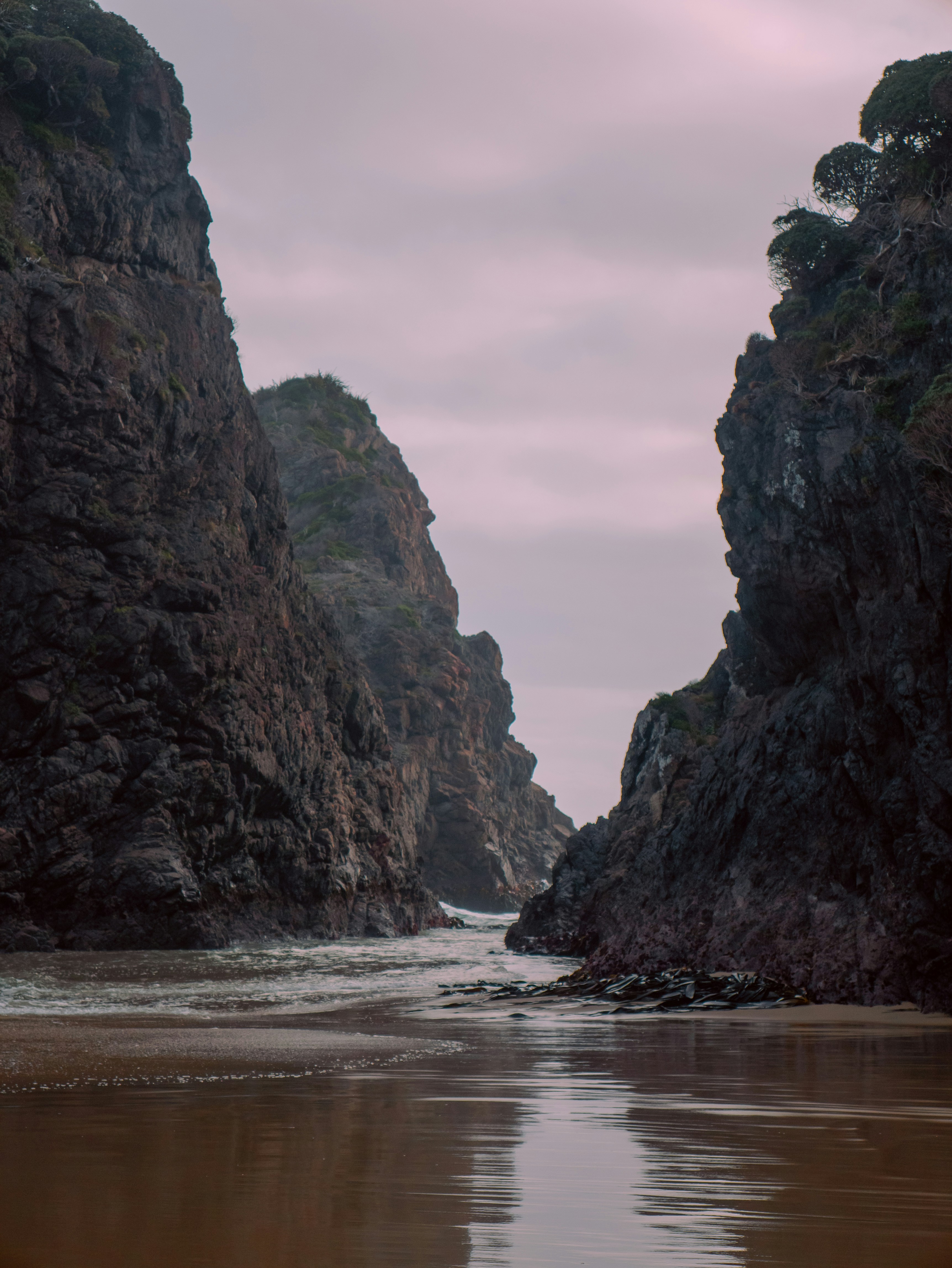 Cored Passage: Light Between Rugged Cliff Walls