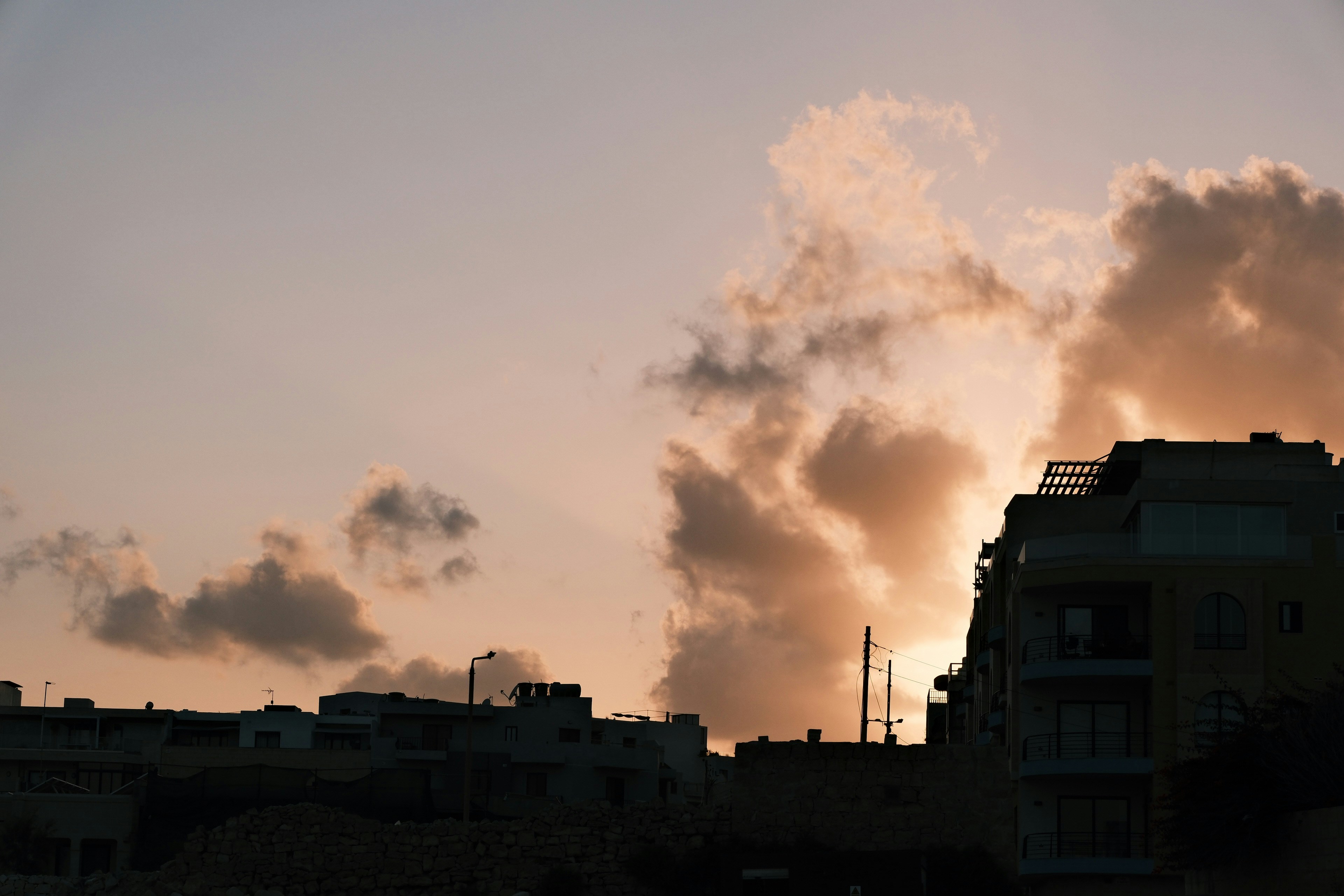 Sunset Sentinel: Horizon Waking Over a Quiet City