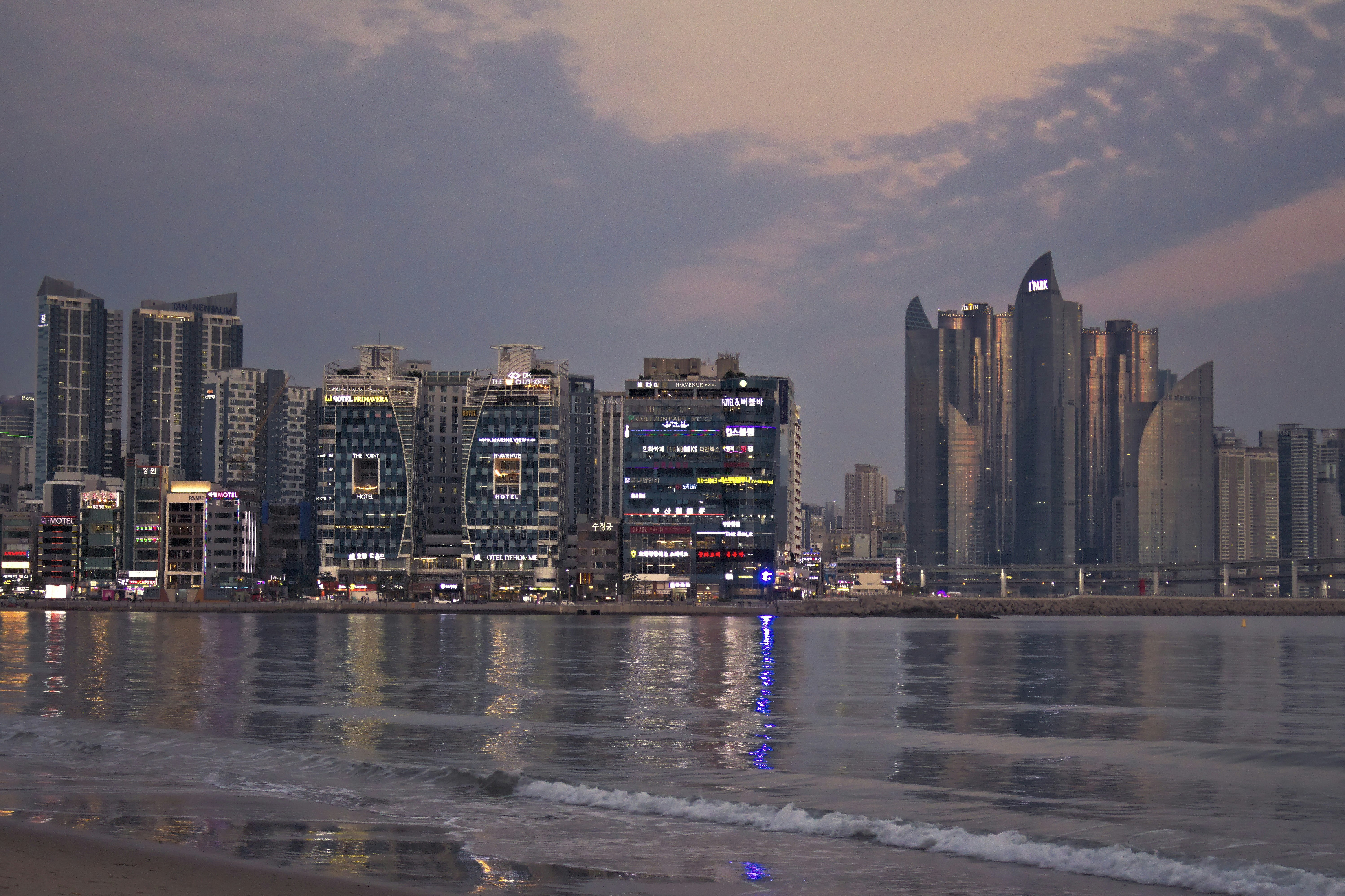 City Lights Along the Shoreline: Reflections on a Quiet Dusk