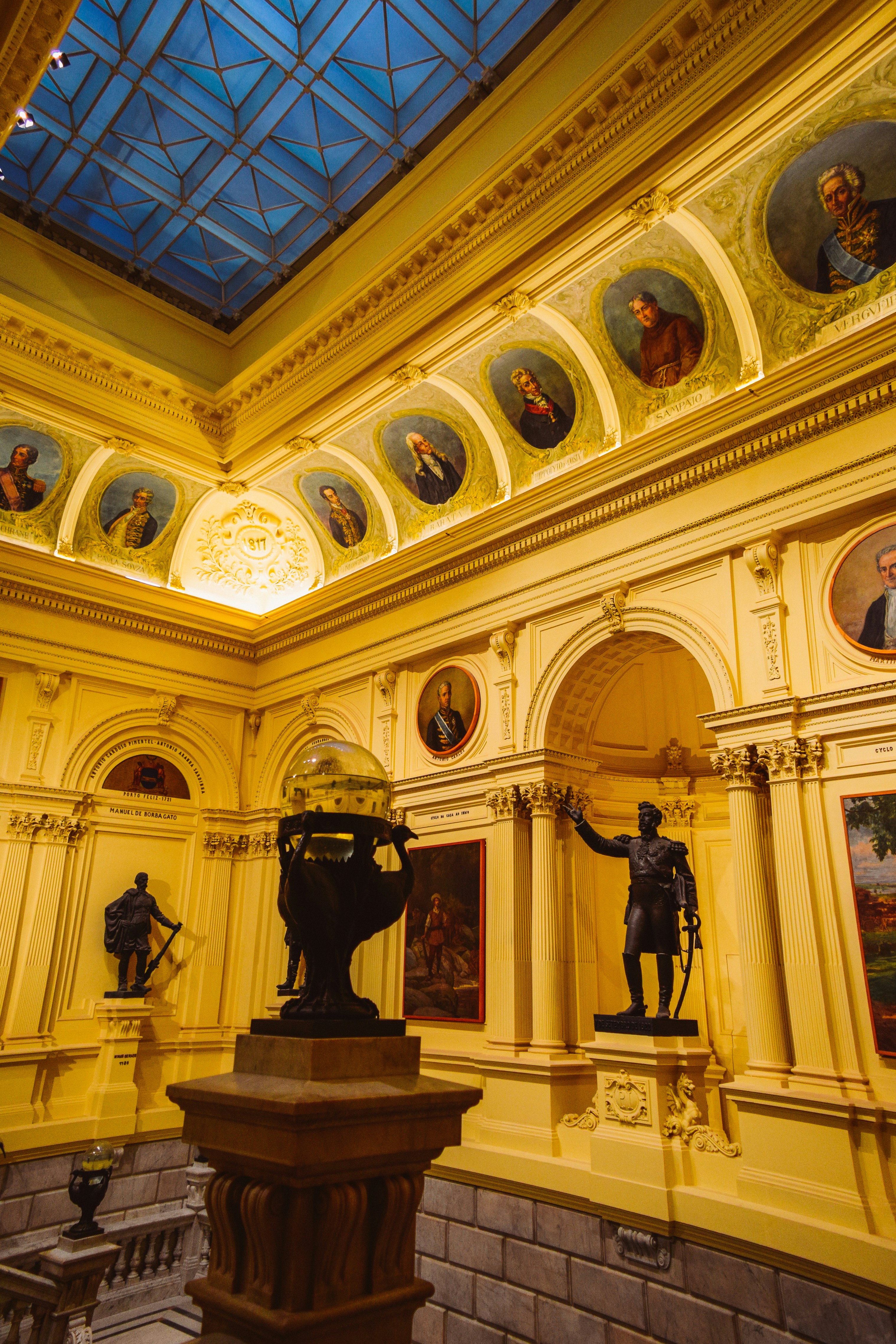 Echoes of Empire: Sculpted Statues Beneath Painted Portraits
