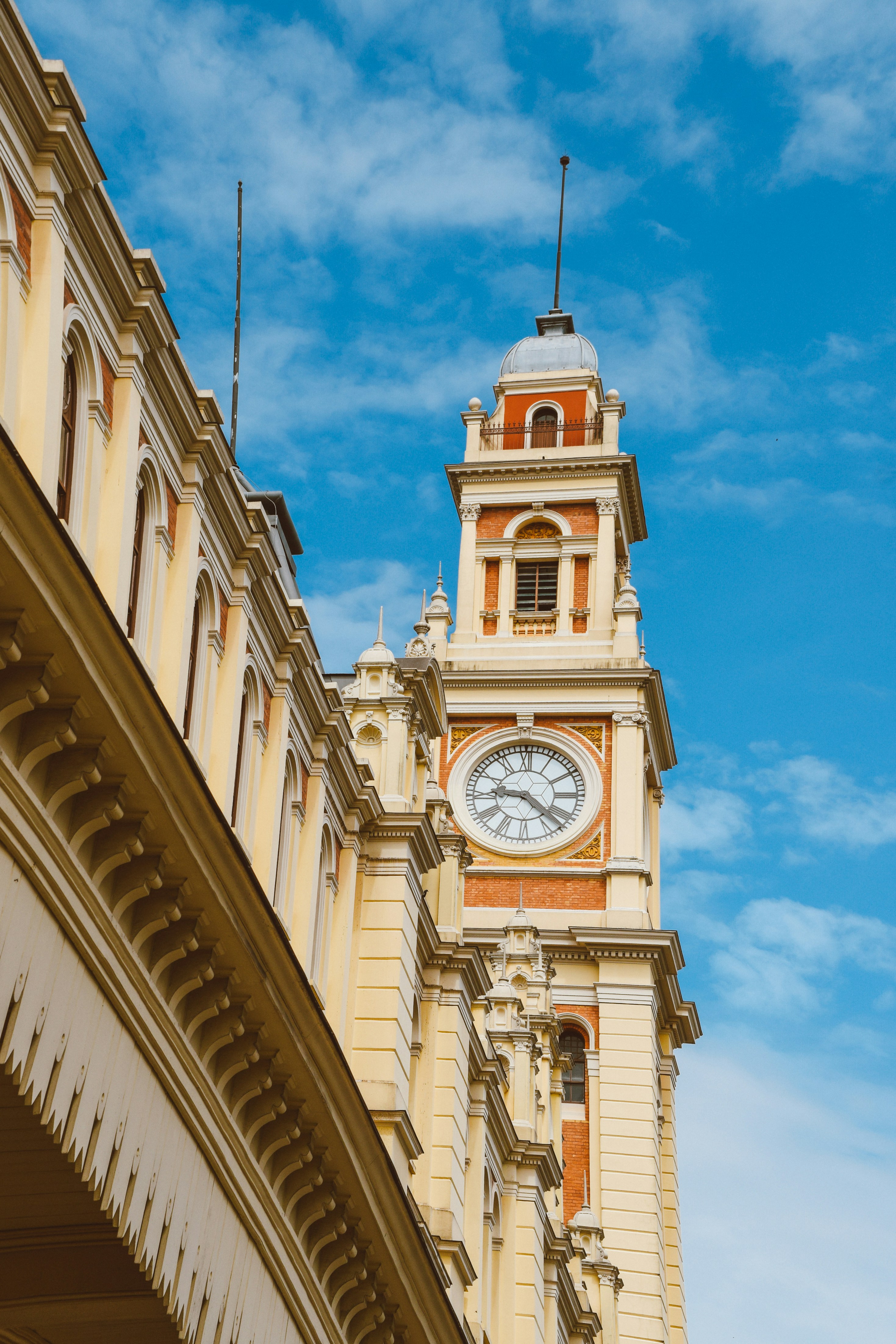 Skyward Clocktower Rise over Colonial Facade