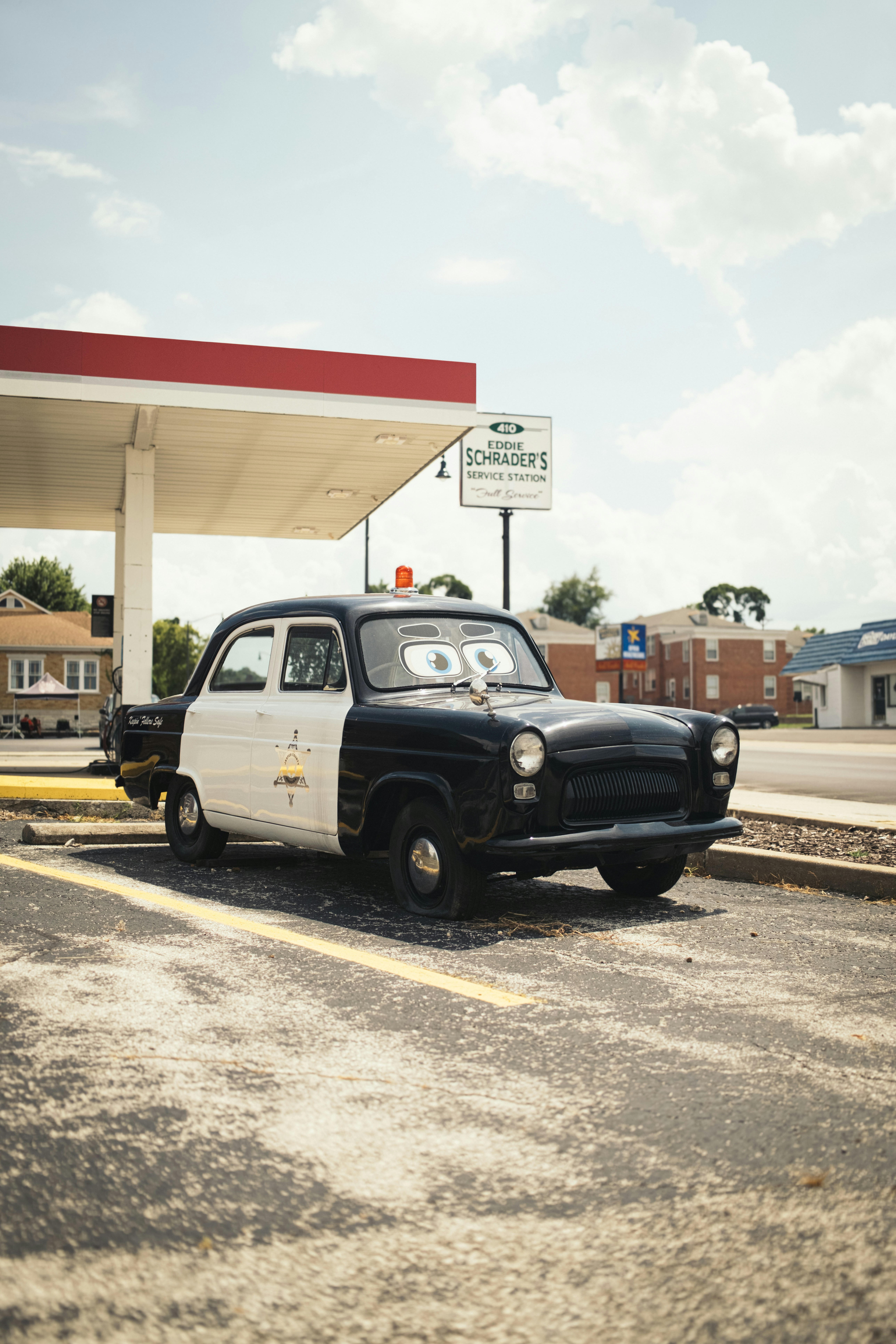 Eyes on the Road: Vintage Police Car under a Quiet Texan Sky