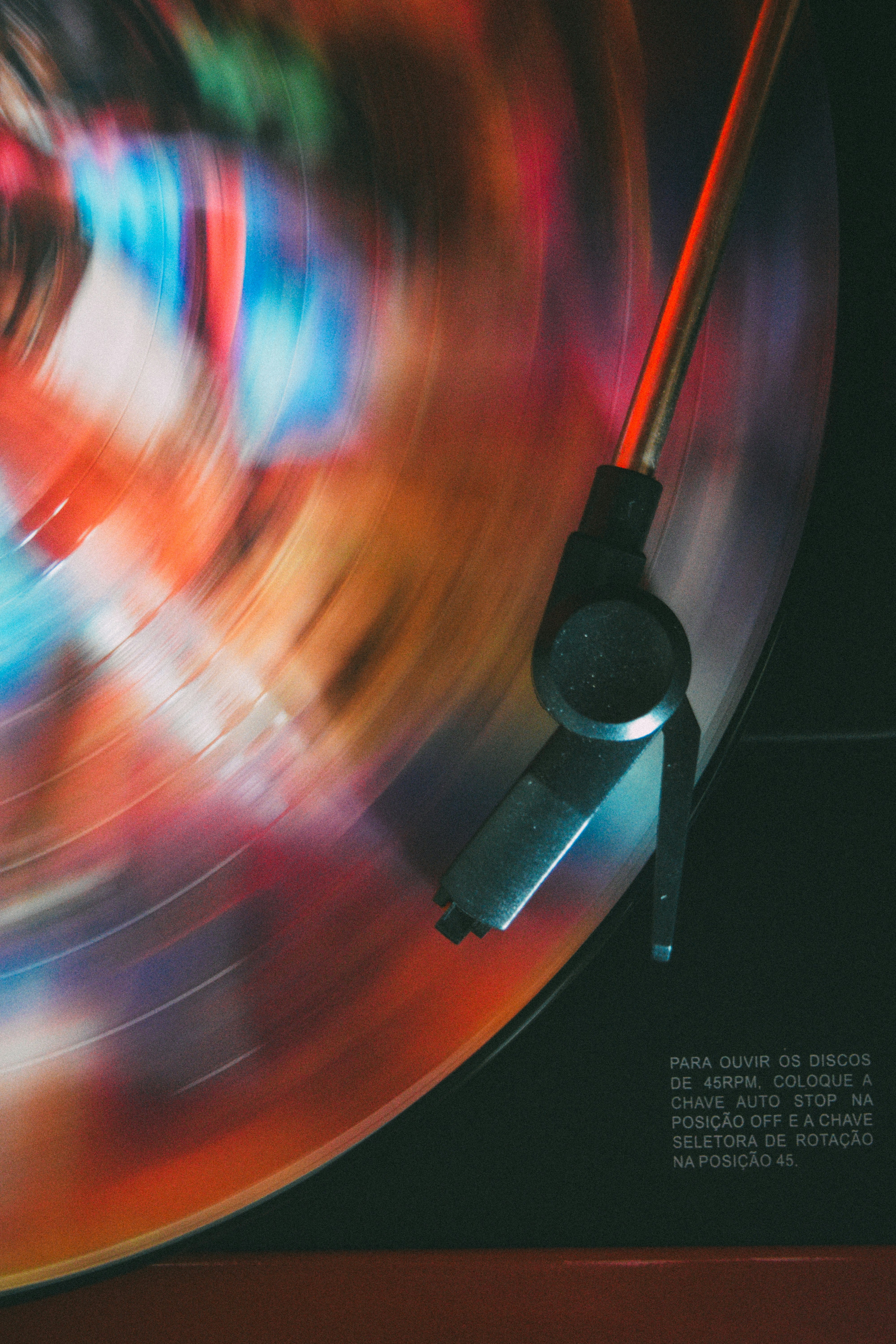 Spin of Color: A Close-Up on the Vinyl and Tonearm in Motion