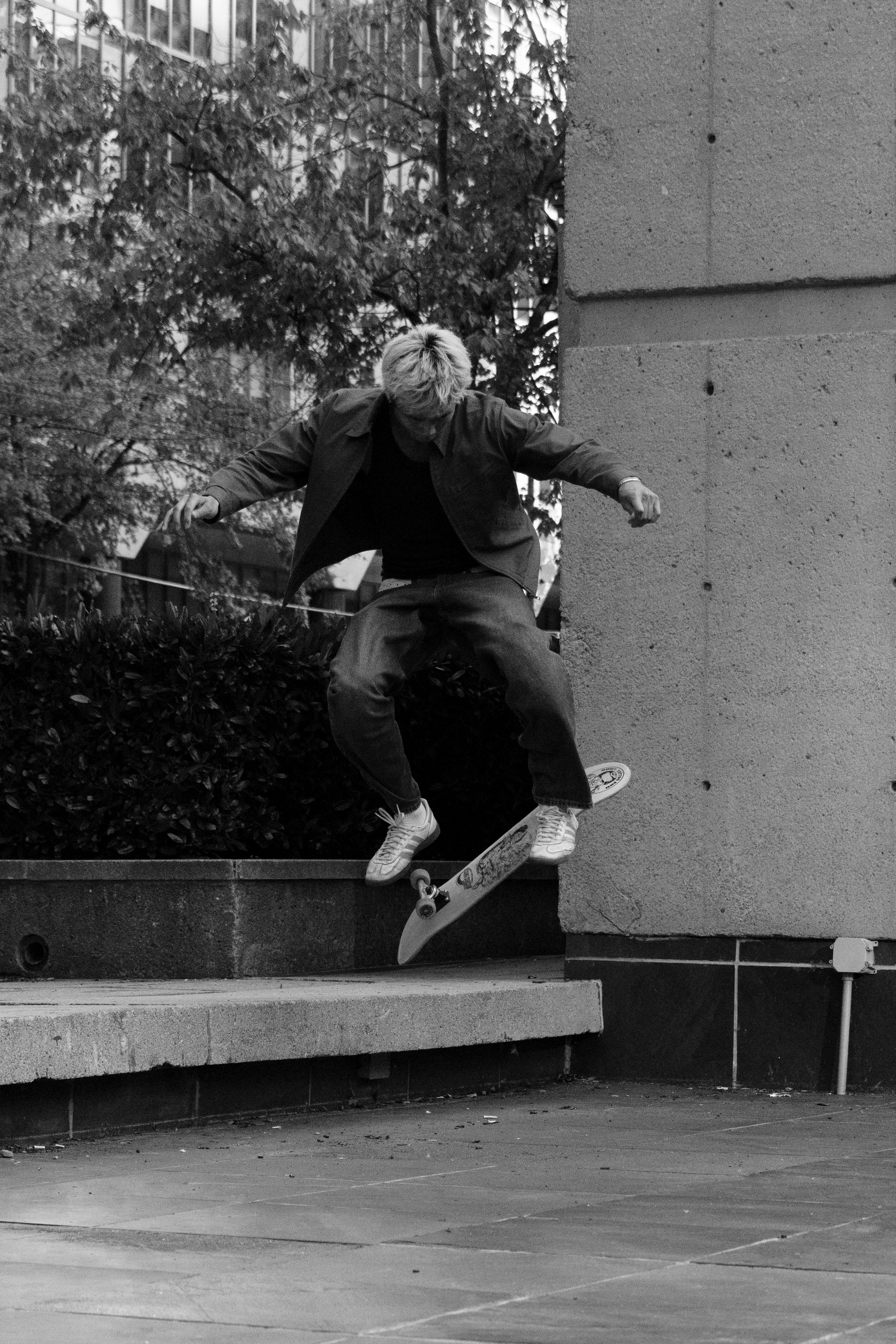 Midair Kick: Skater Jumps Off a Concrete Step