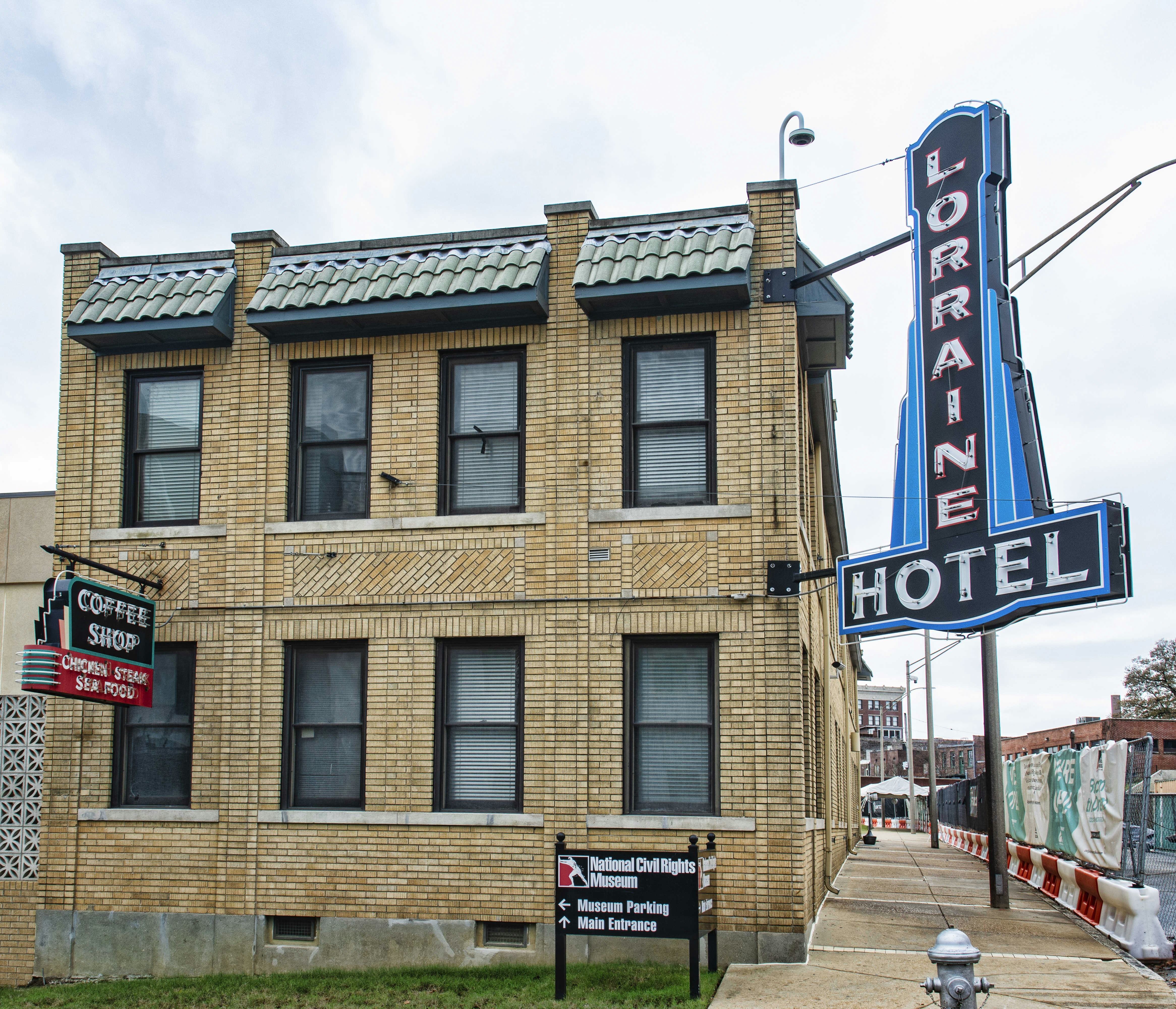 Neon Vintage: The Corner Lot Hotel Sign Casting a Blue Glow