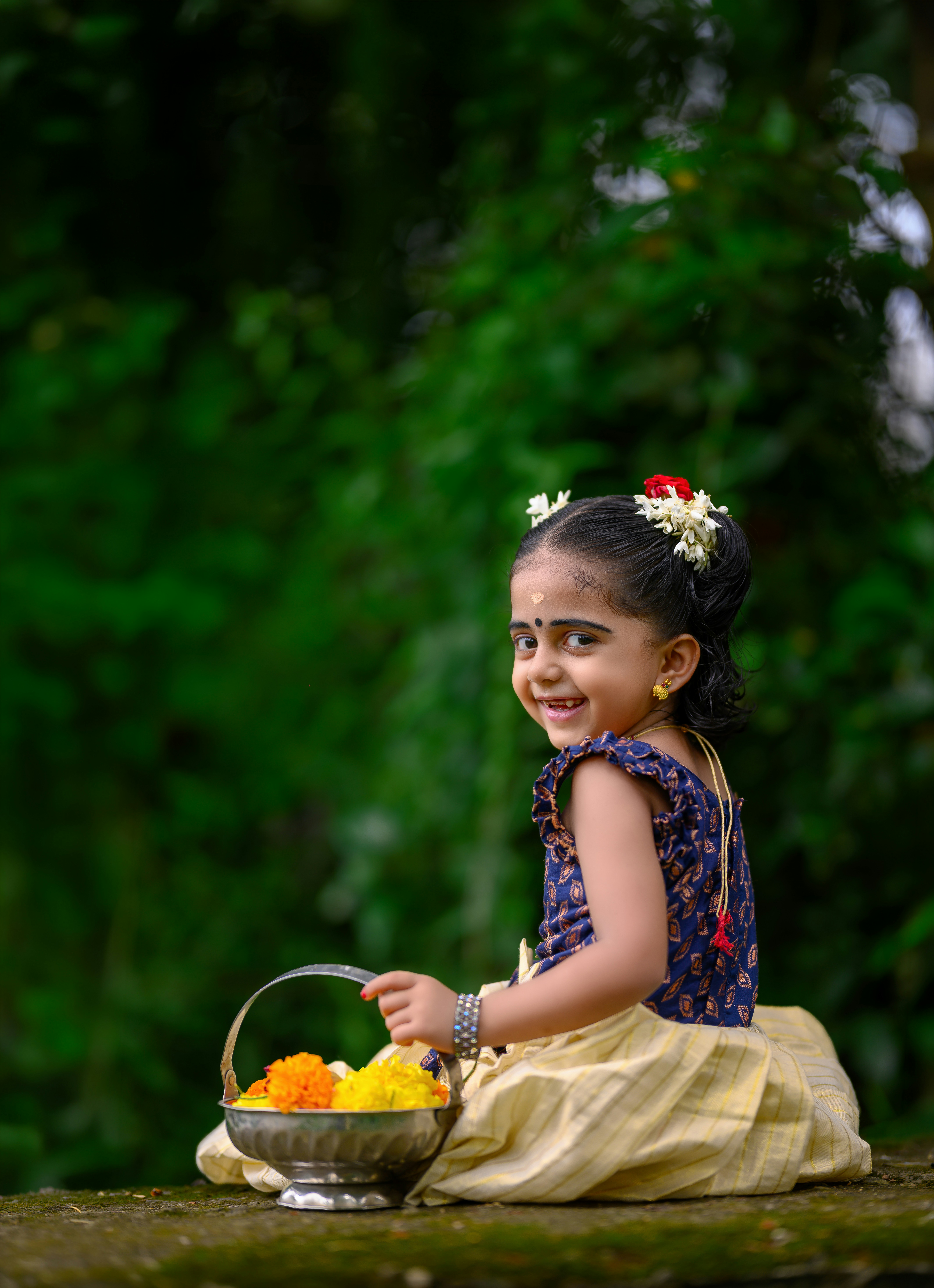 Joyful Dance in Floral Attire by a Muddy Bank