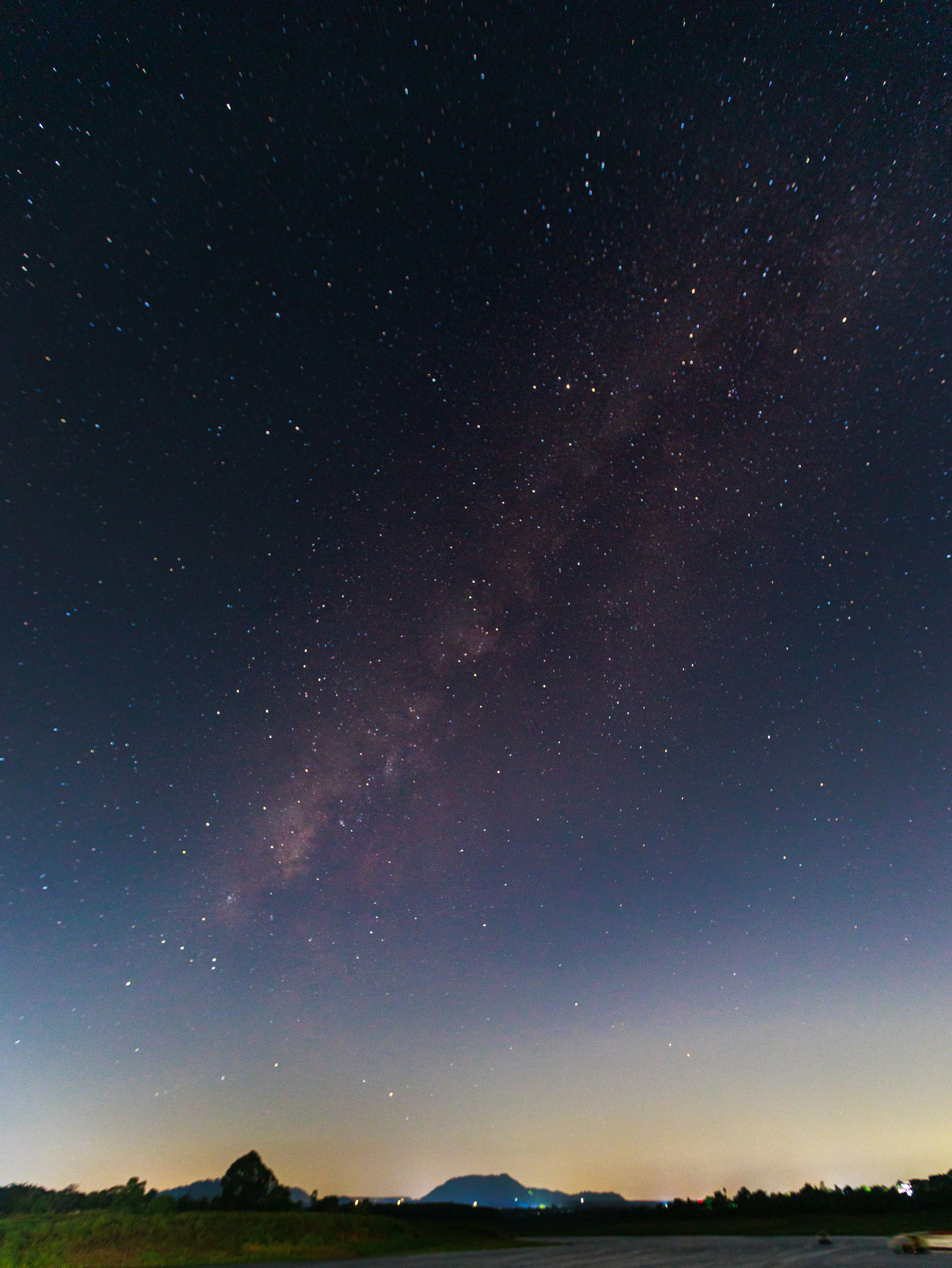 Milky Way Bridge: Stars Above a Quiet Horizon