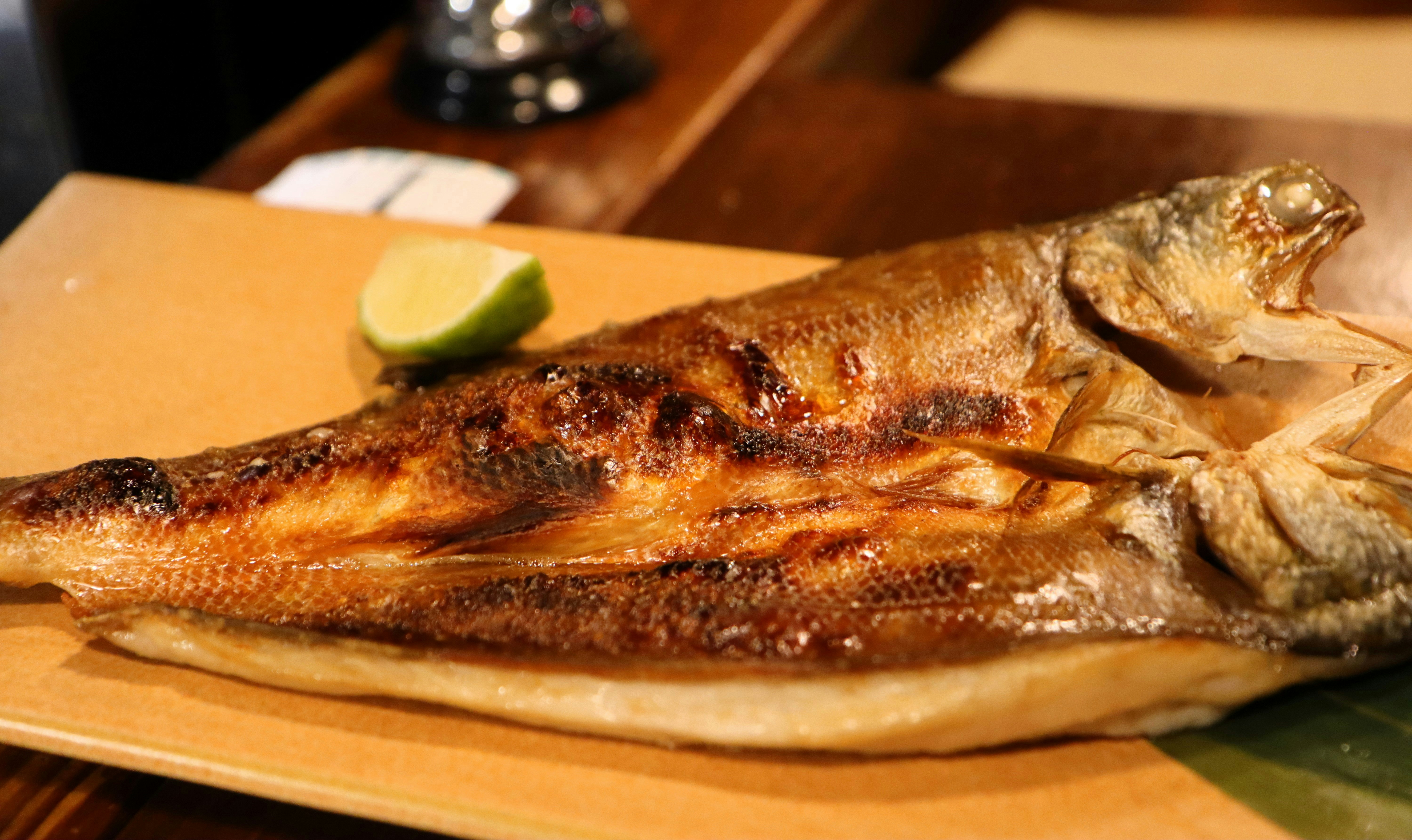 Charred Ribbed Pike: A Citrusy Finish on a Wooden Platter