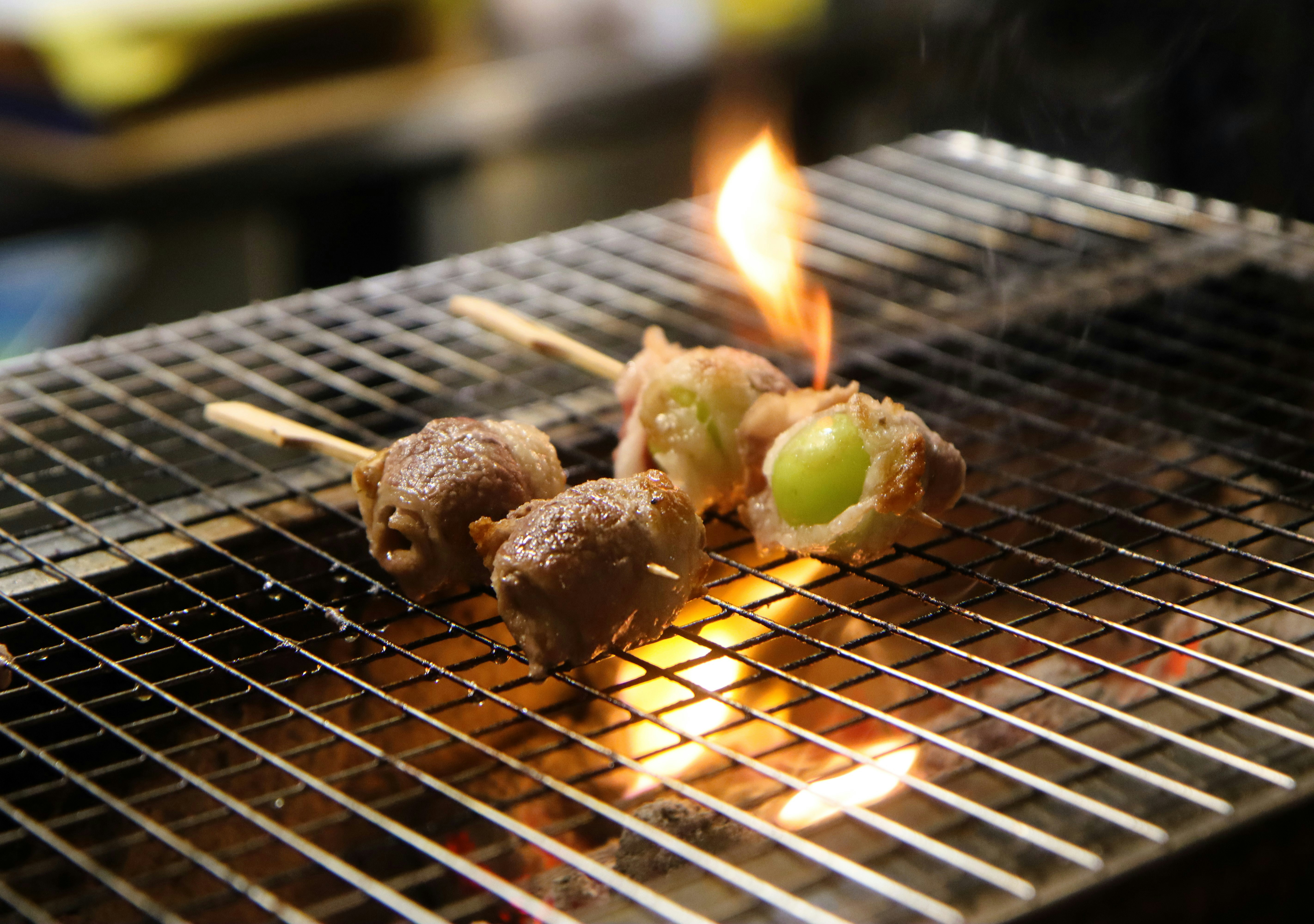 Sizzling skewers on an open grill