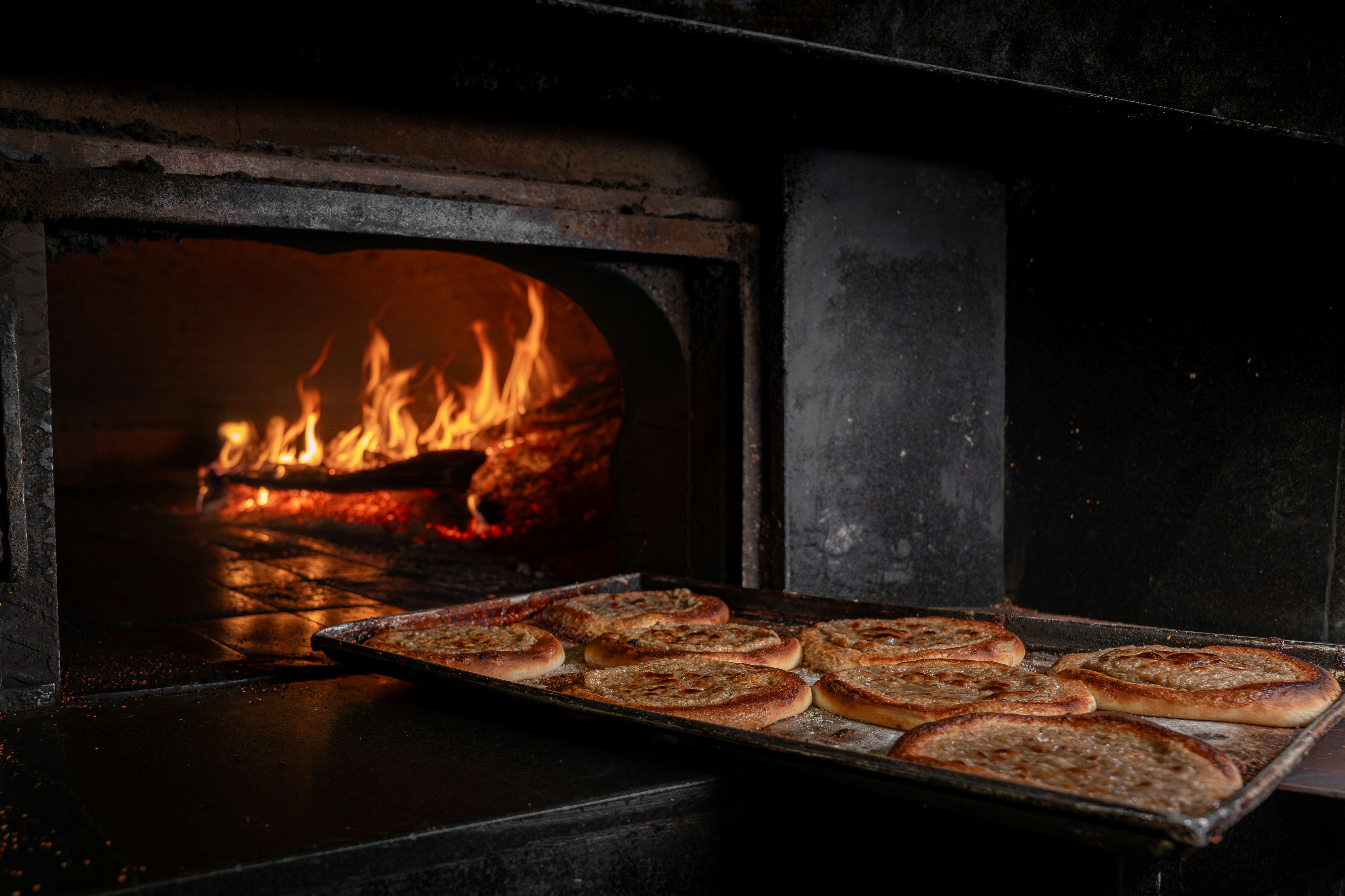 Tray of Pepperoni Pizzas Entering the Hearthlight