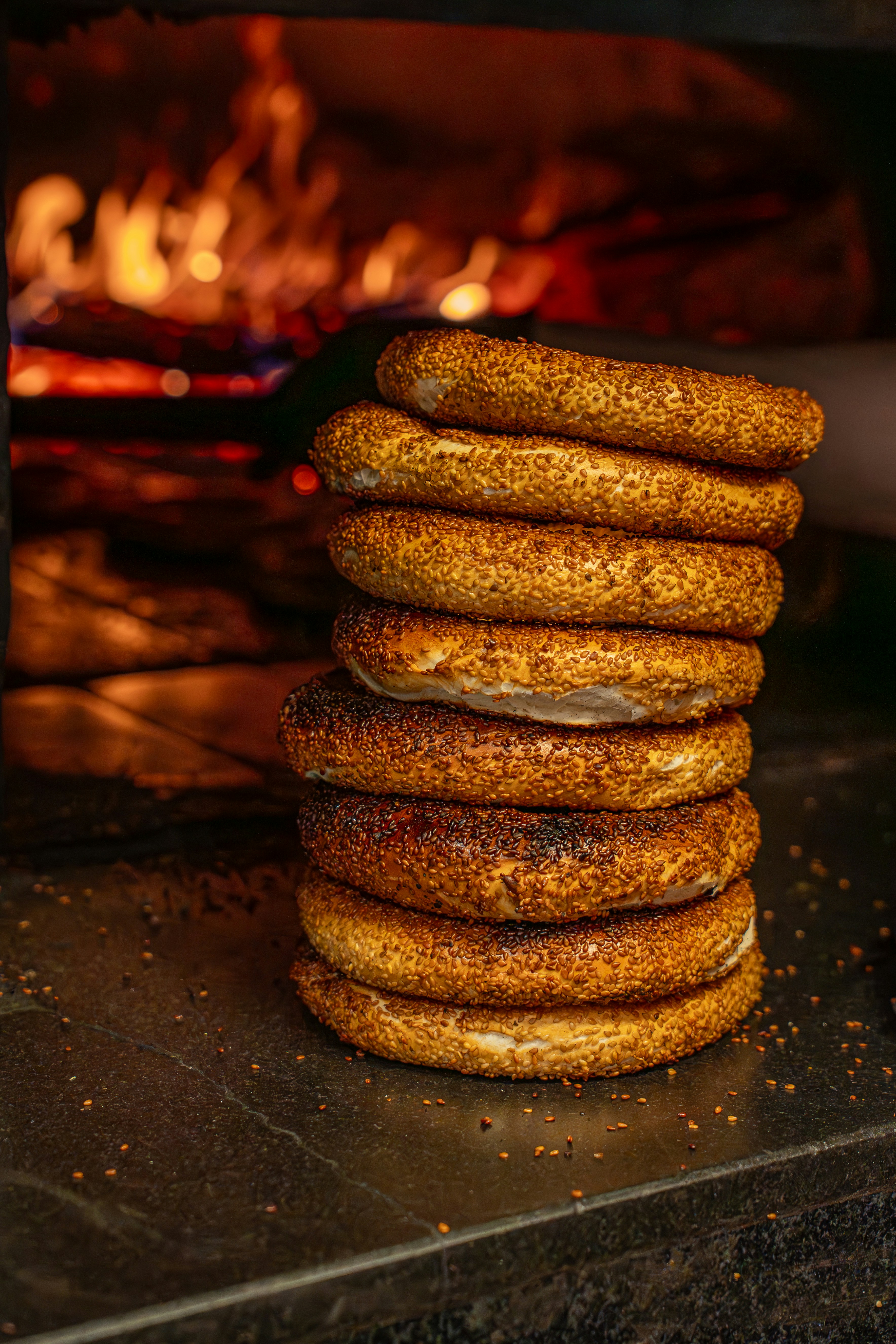 Stack of Sesame-Seeded Bagels by a Ember Glow