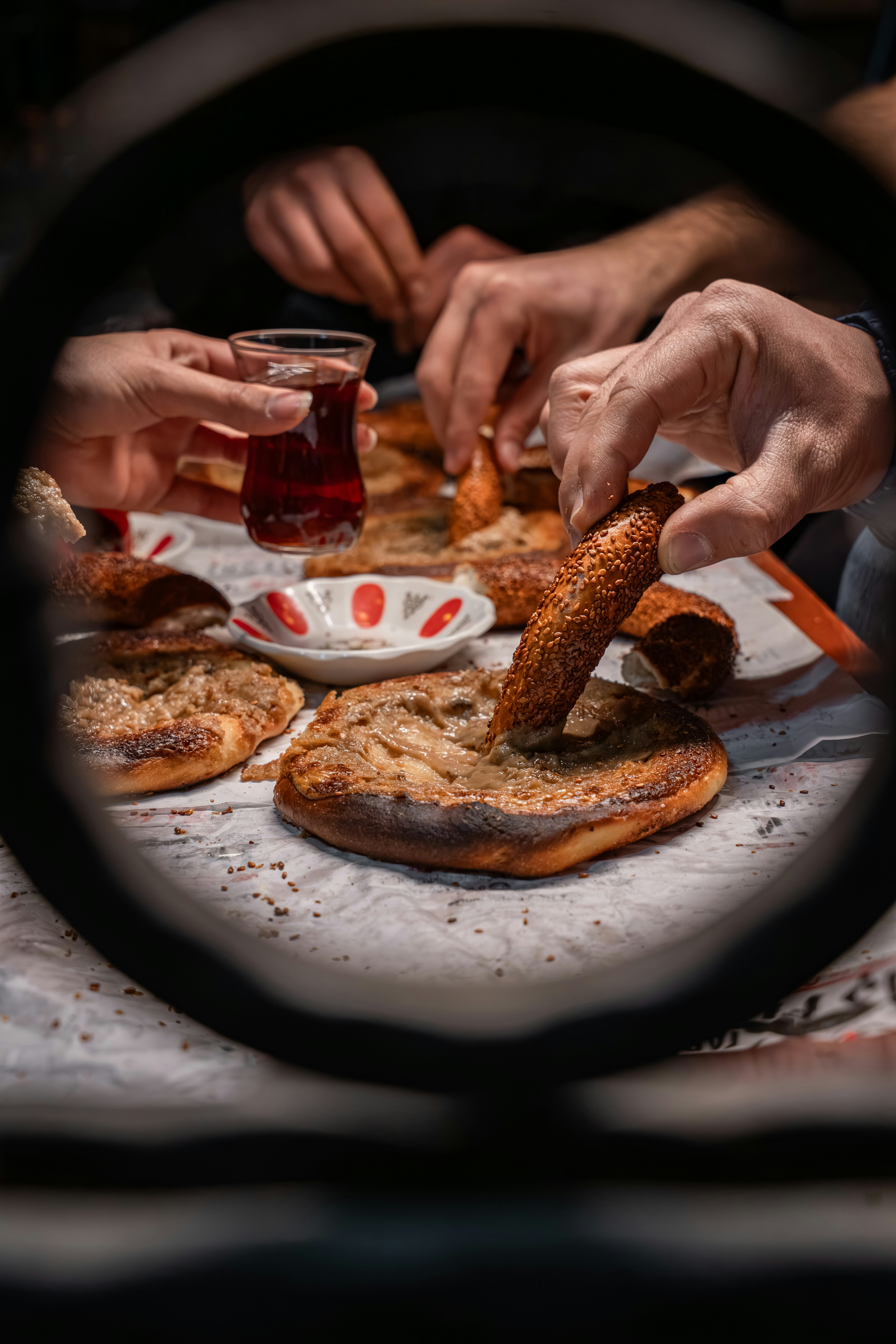 Hands Dive into Crunch: Garlic Butter Perfection at Table Reach