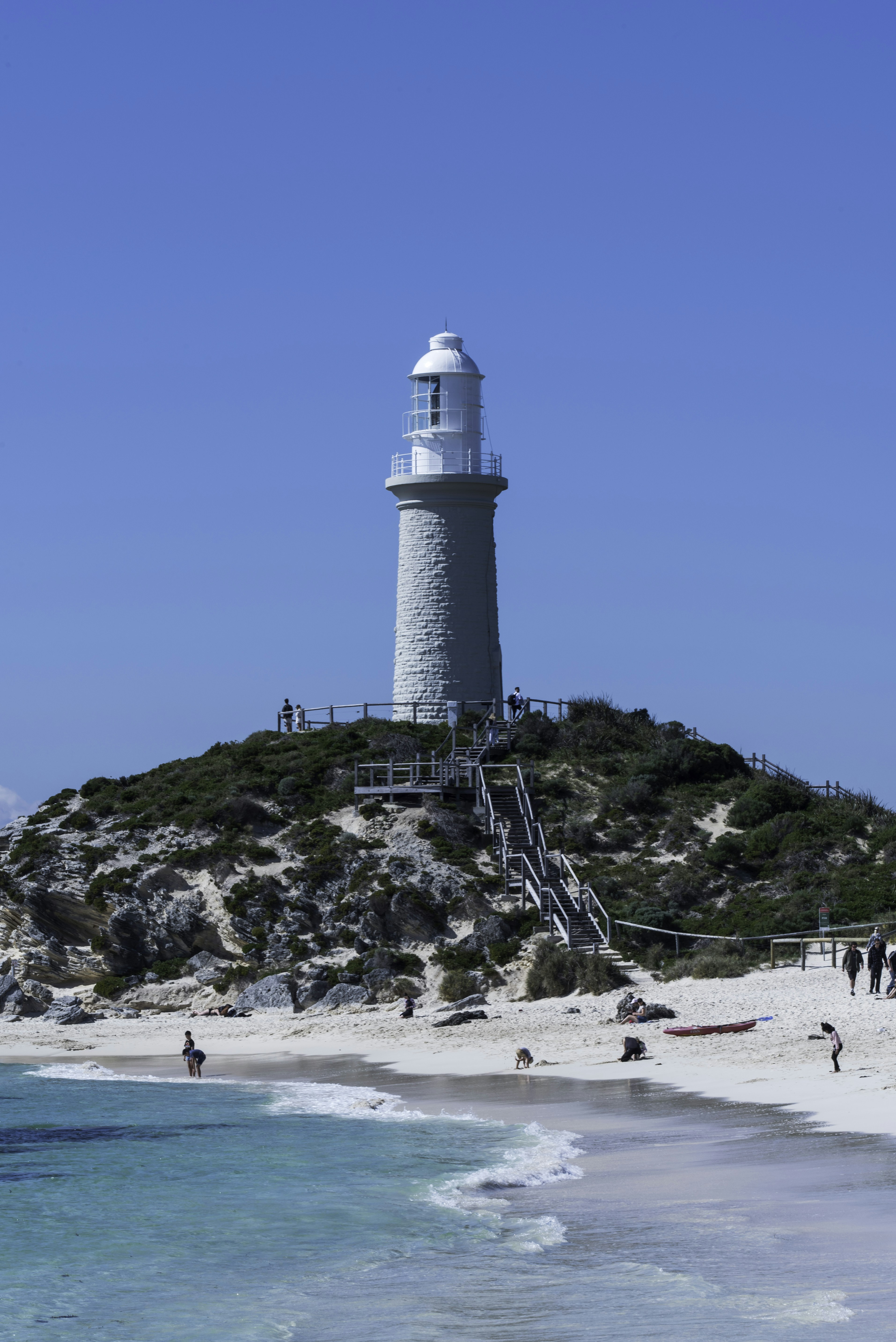 Lighthouse Sentinel: A coastal outpost under a cerulean sky