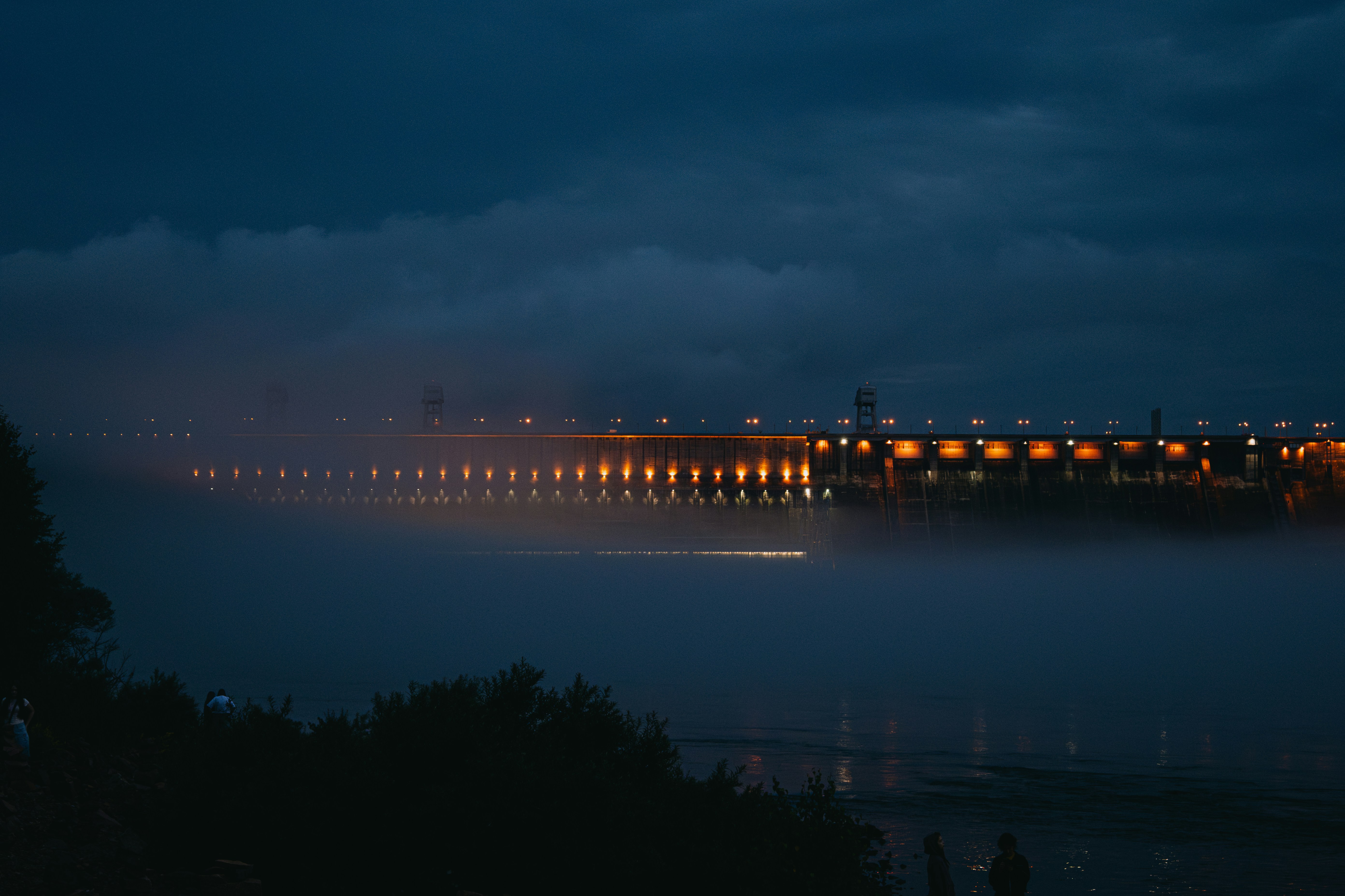 Bridge of Amber Echoes Over Quiet Waters