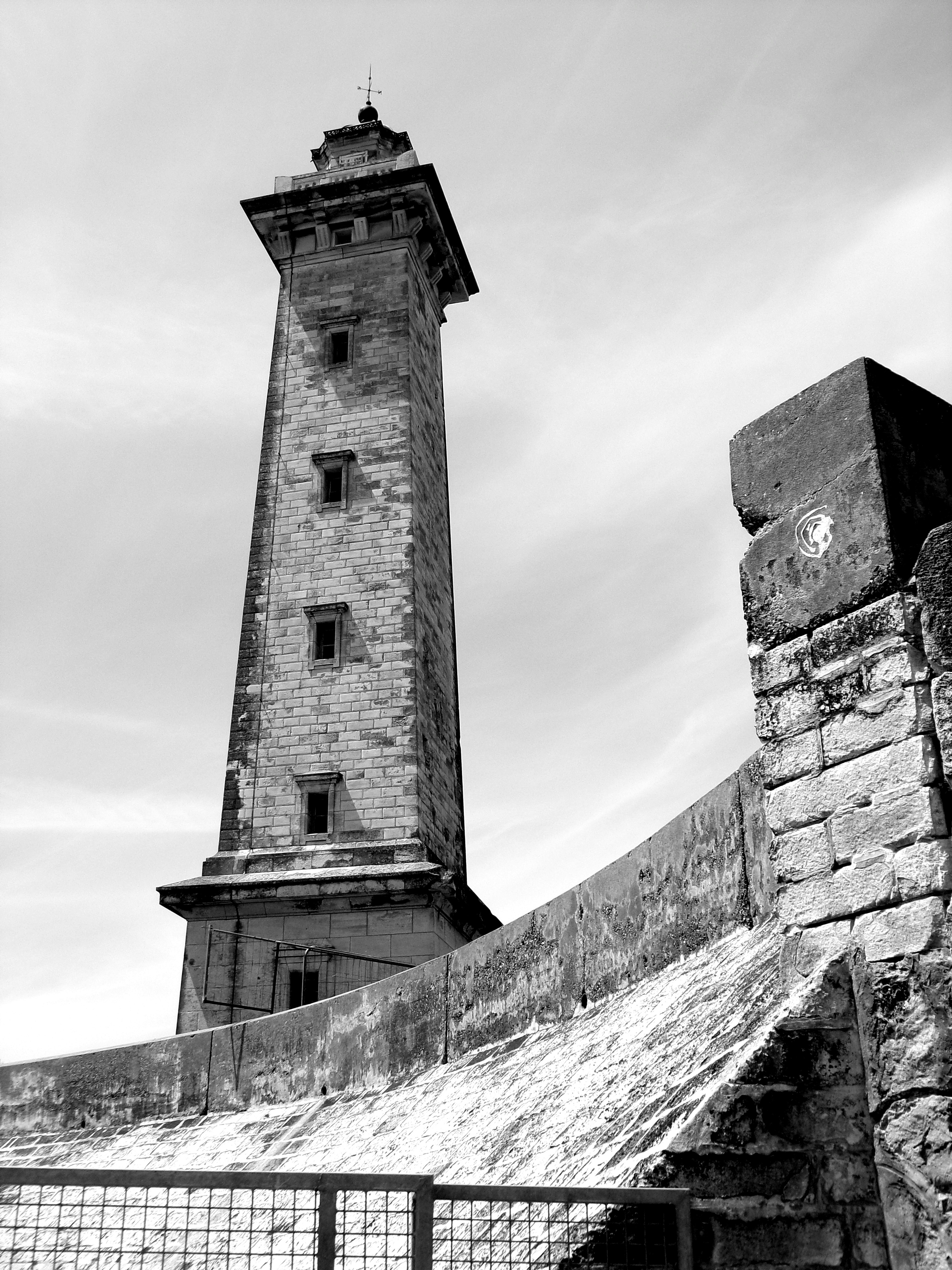 Stone Sentinel: A Tower Rising Above the Curved Terrace