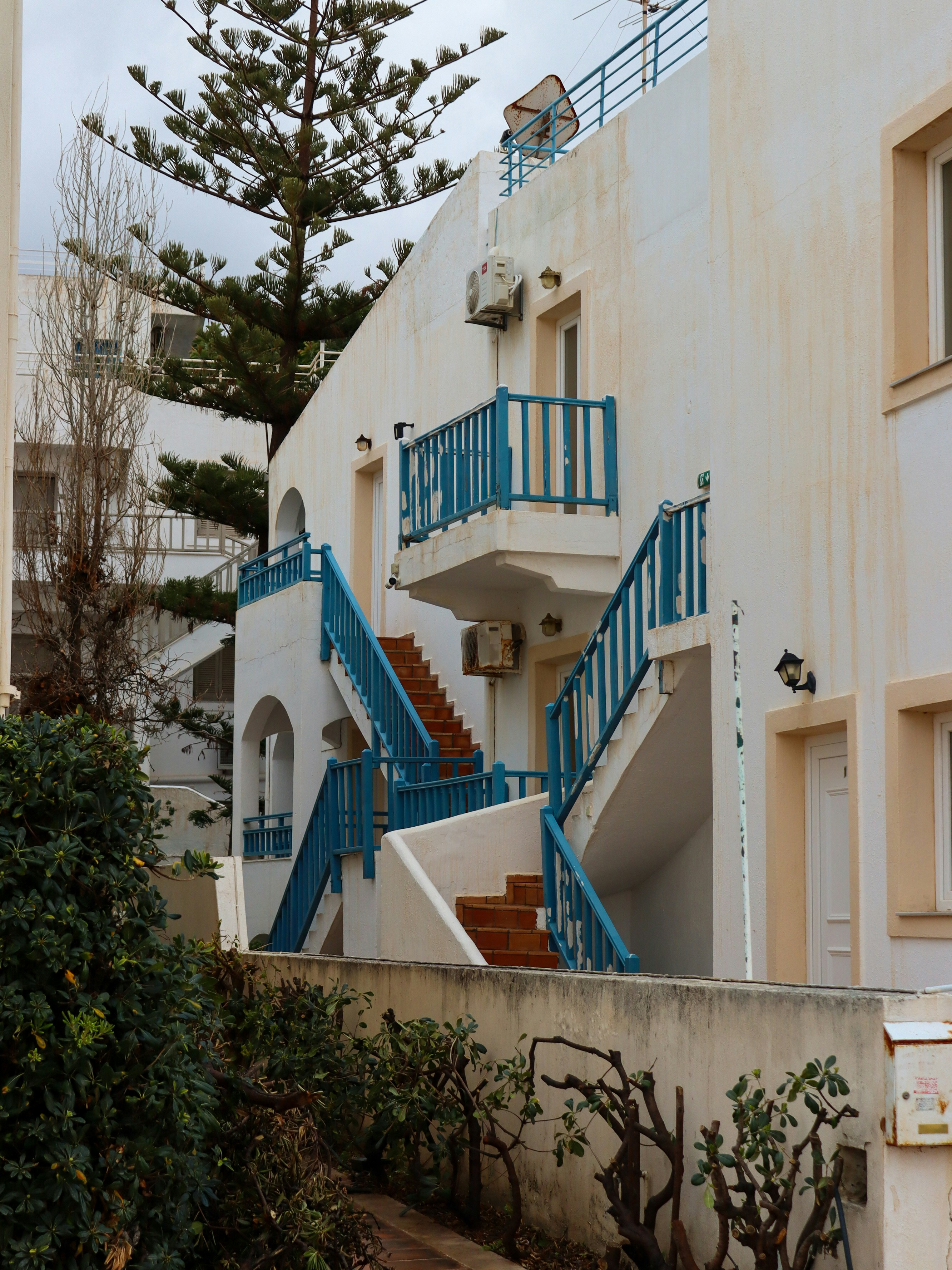 Blue Staircase Odyssey: A Mediterranean Courtyard