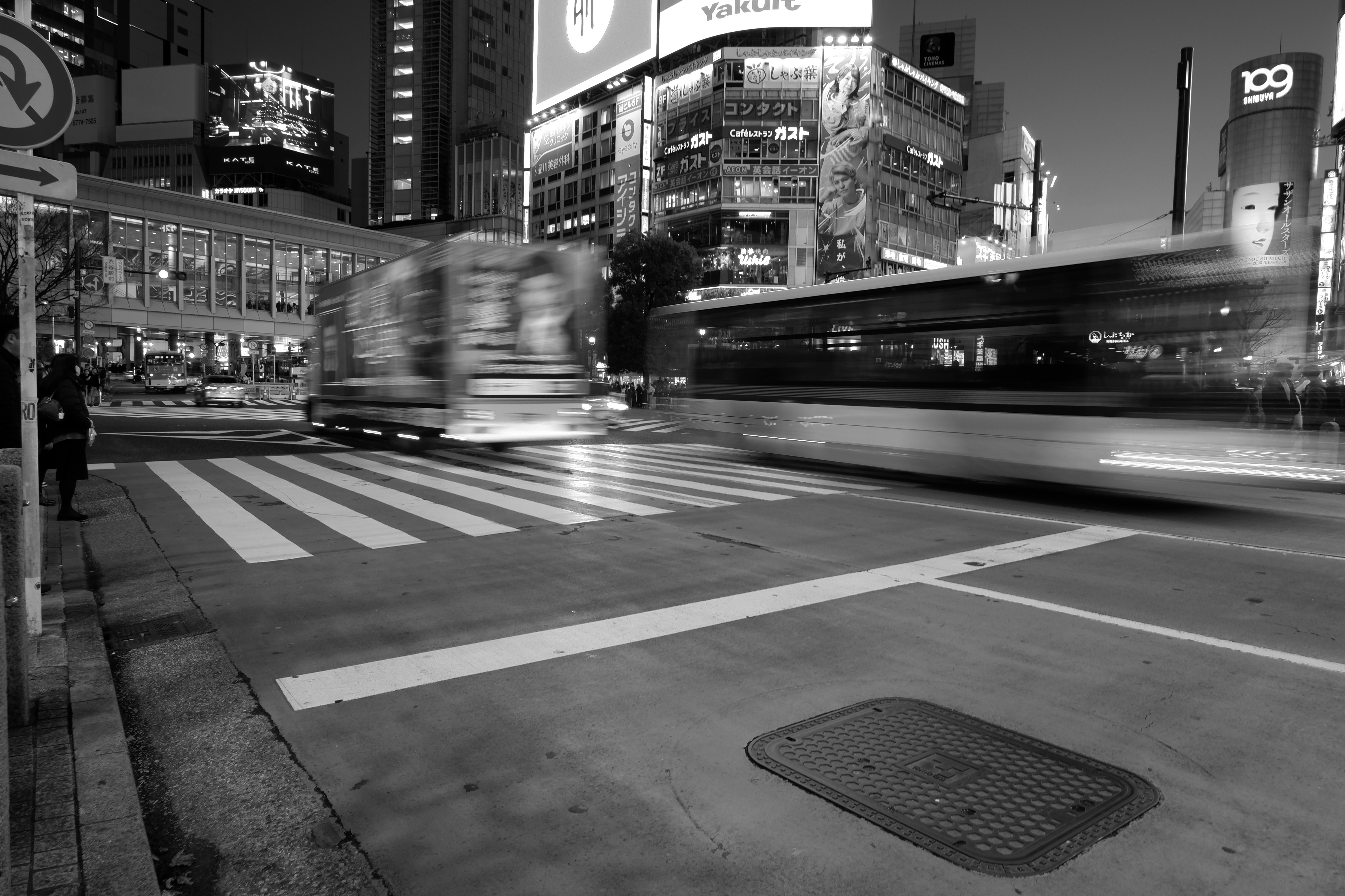 Night Pulse in Neon Streets: Blurred Traffic Over Crosswalk