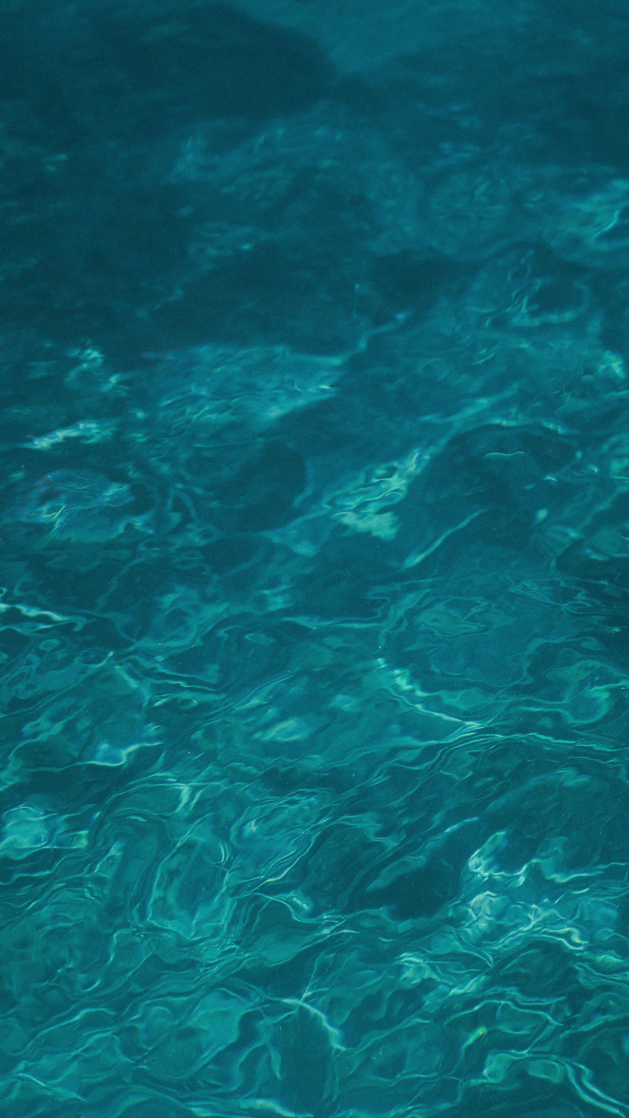 Aqua Mosaic: Sunlit Ripples on Teal Seas