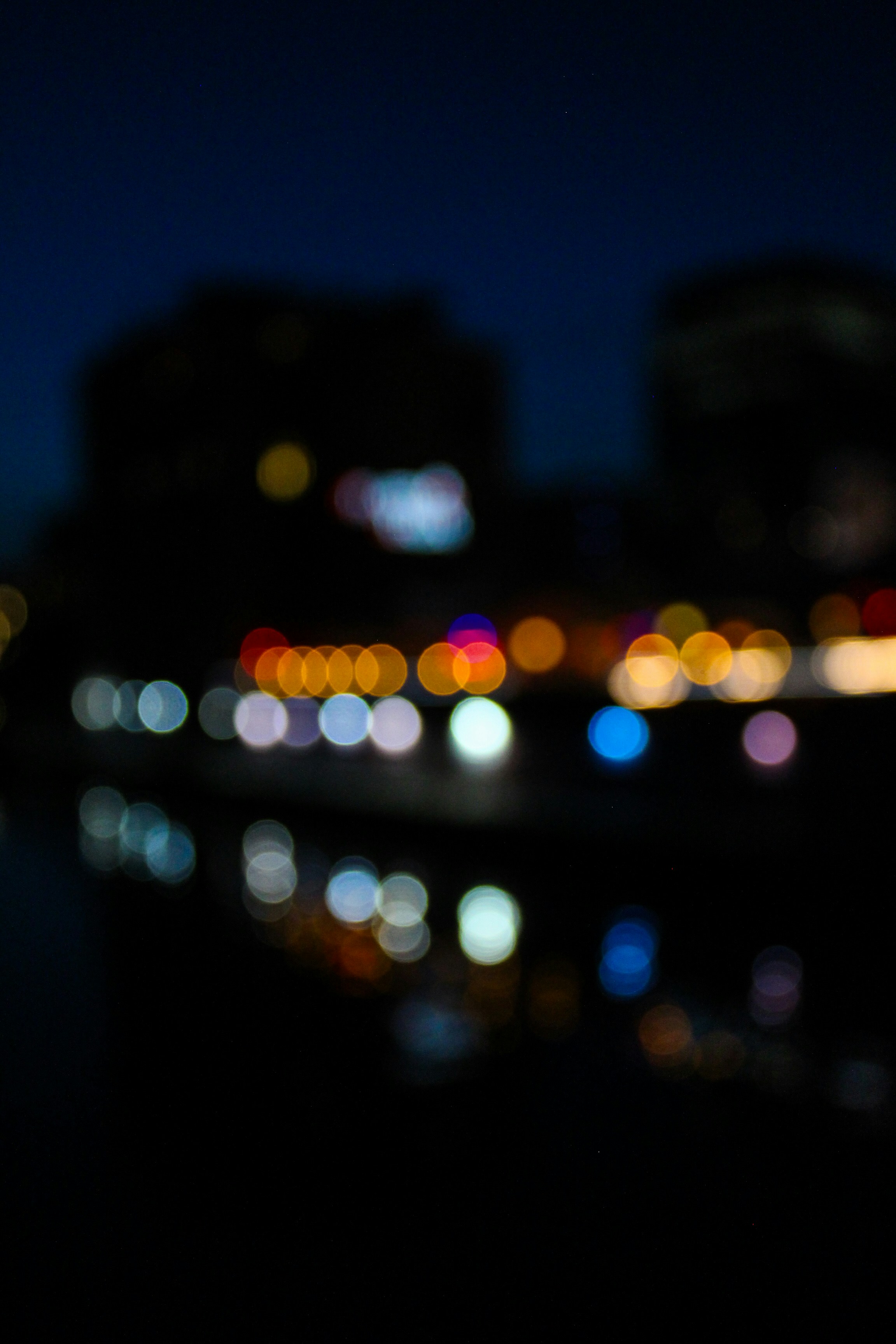 Soft City Lights: A Blur of Night Reflections