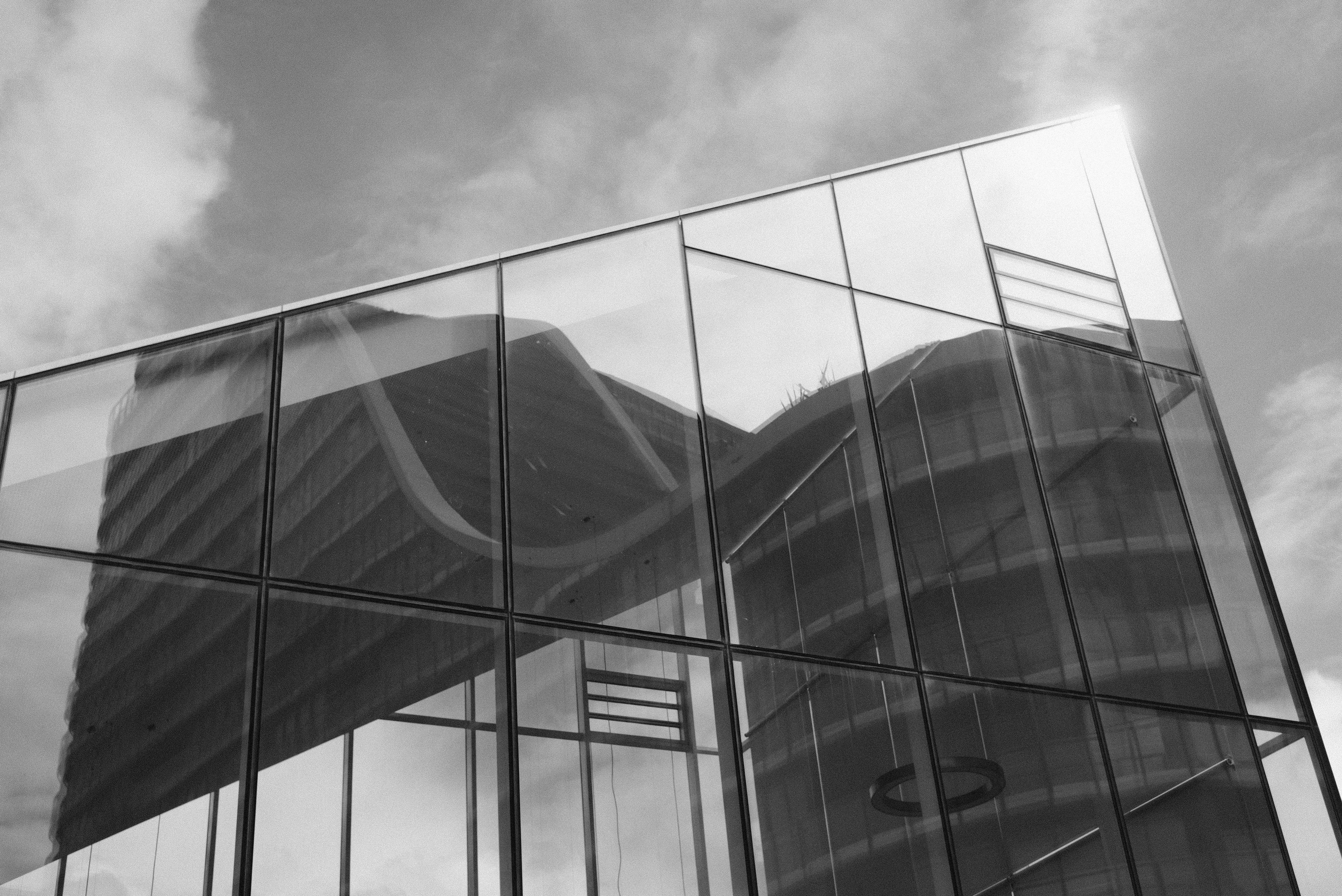 Reflections in Modern Glass: A Cloaked Geometry