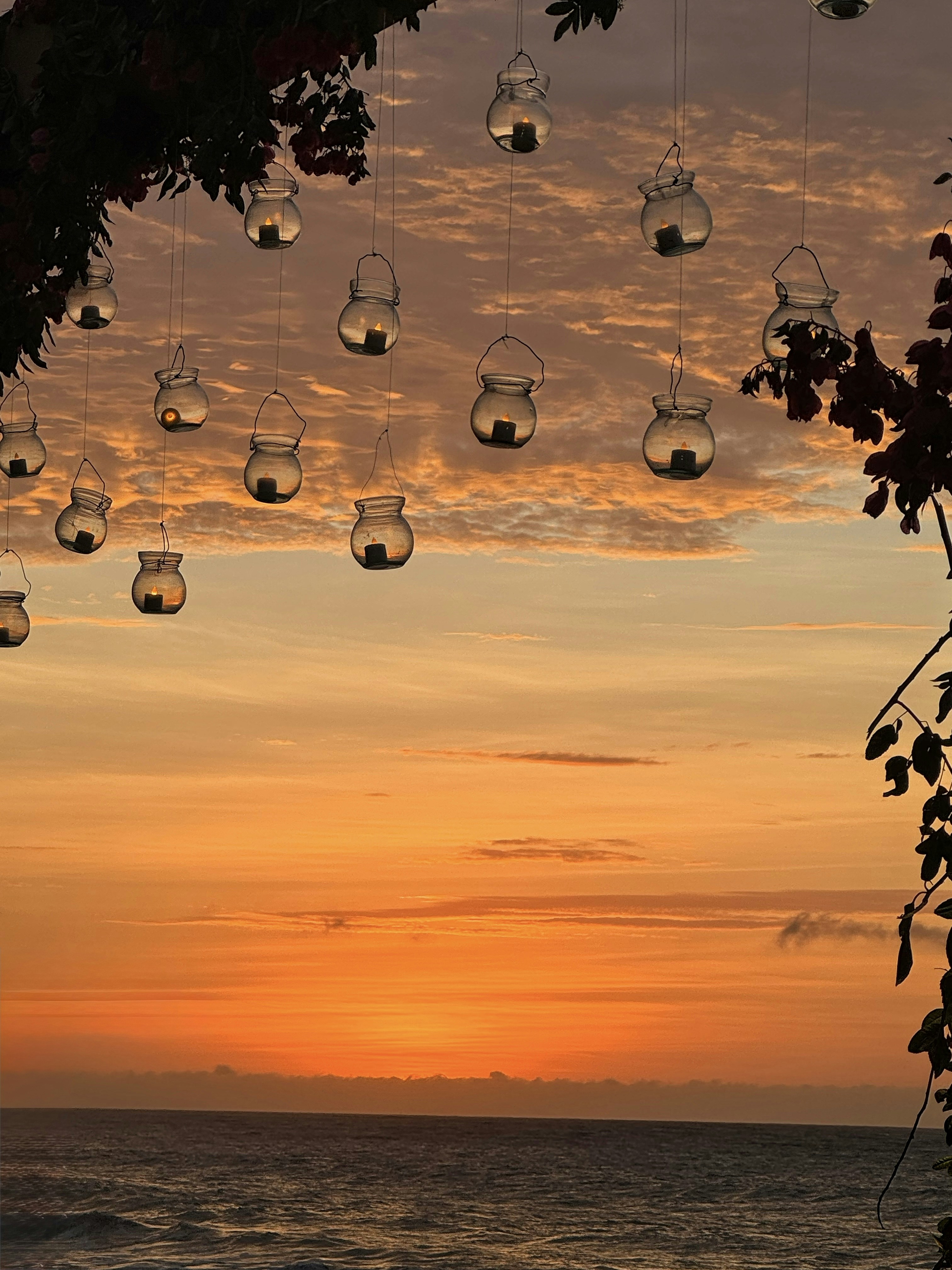 Hanging Lanterns Over a Sunset Sea