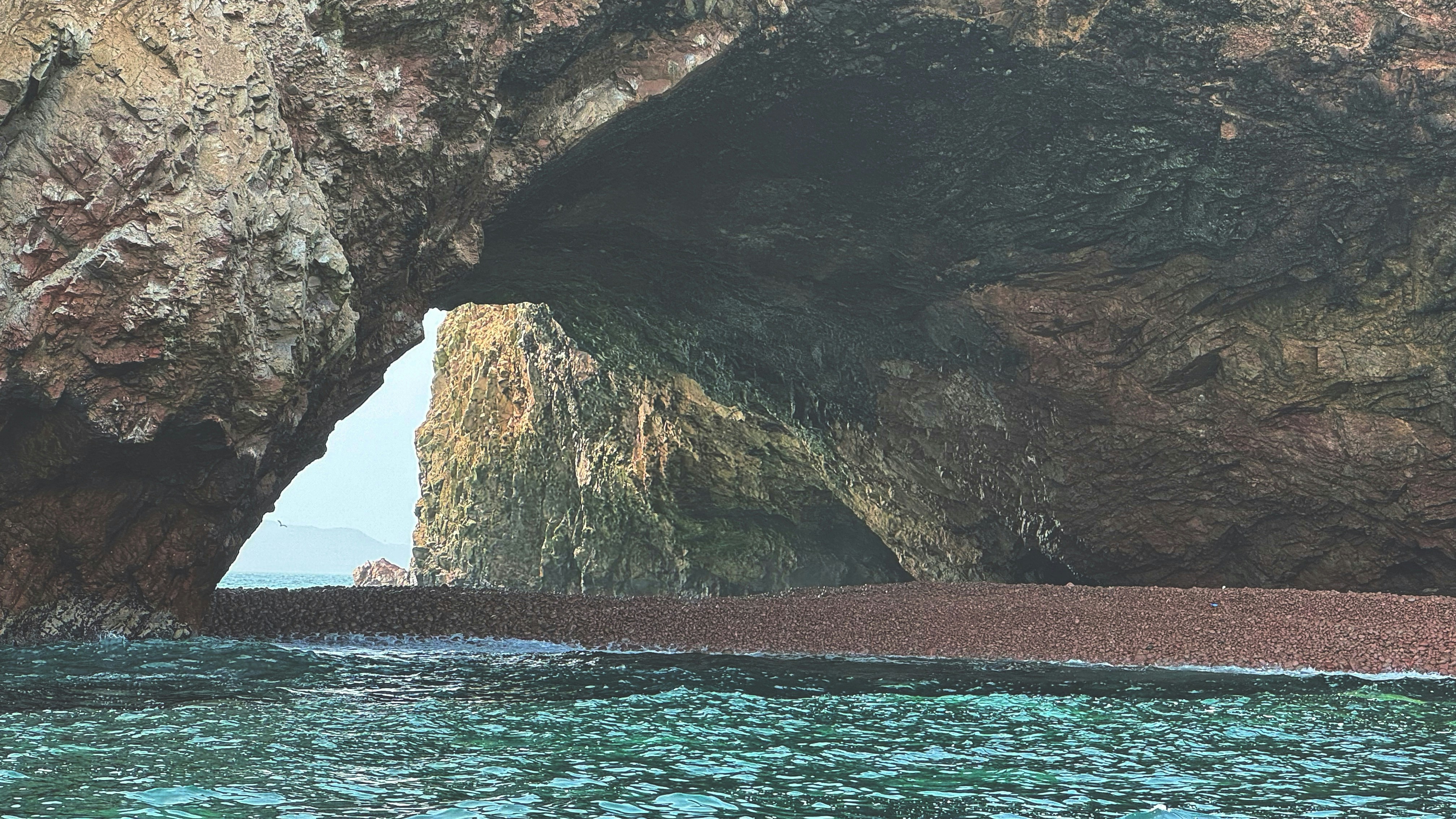 Sea Arch Through a Cliff Window