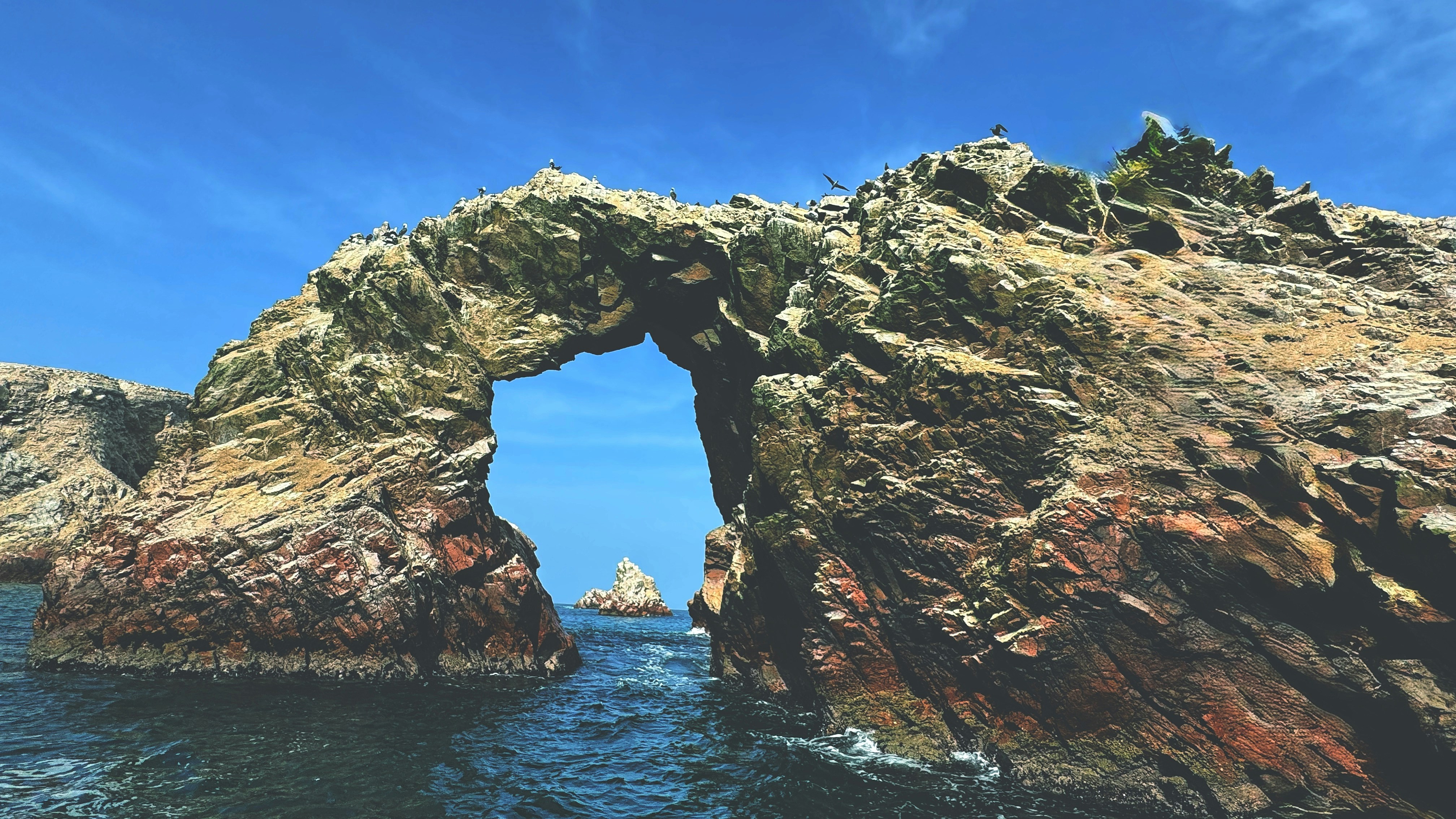 Coastal Arch Framed by Whirlpool of Blue