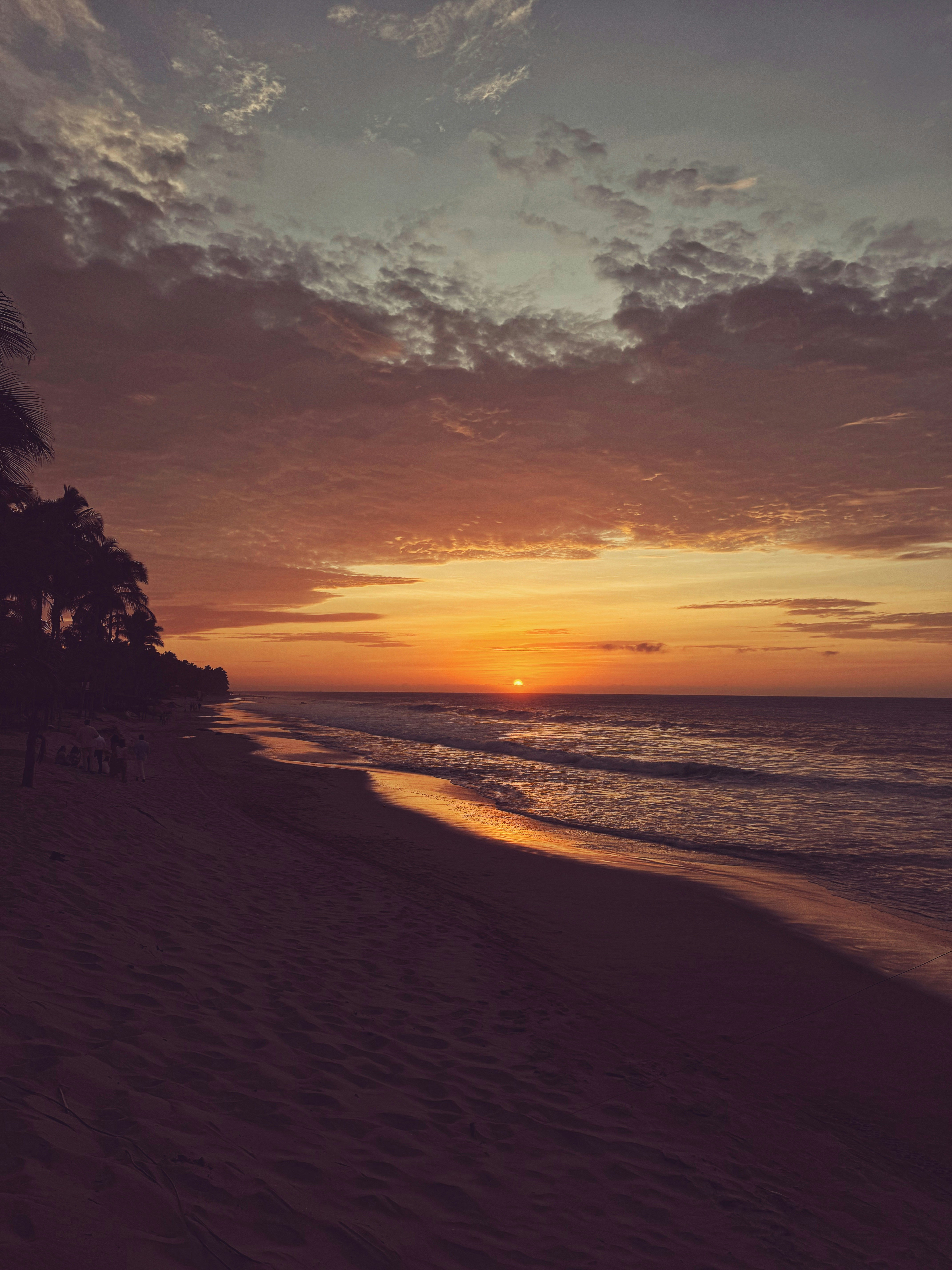 Dusk on the Quiet Shore: A Sunset Surrender to Waves