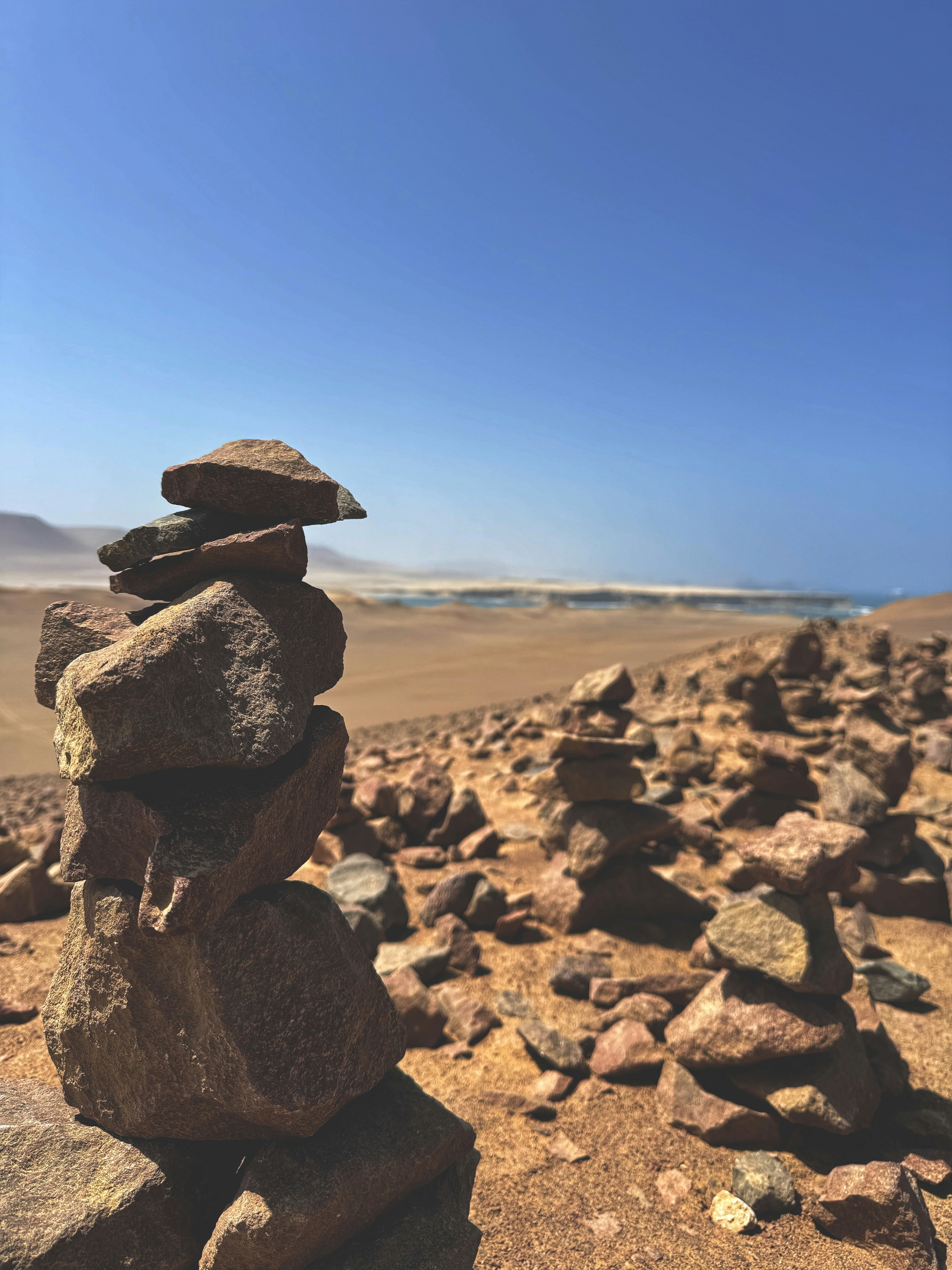 Balanced Cairn at a Seaside Dune