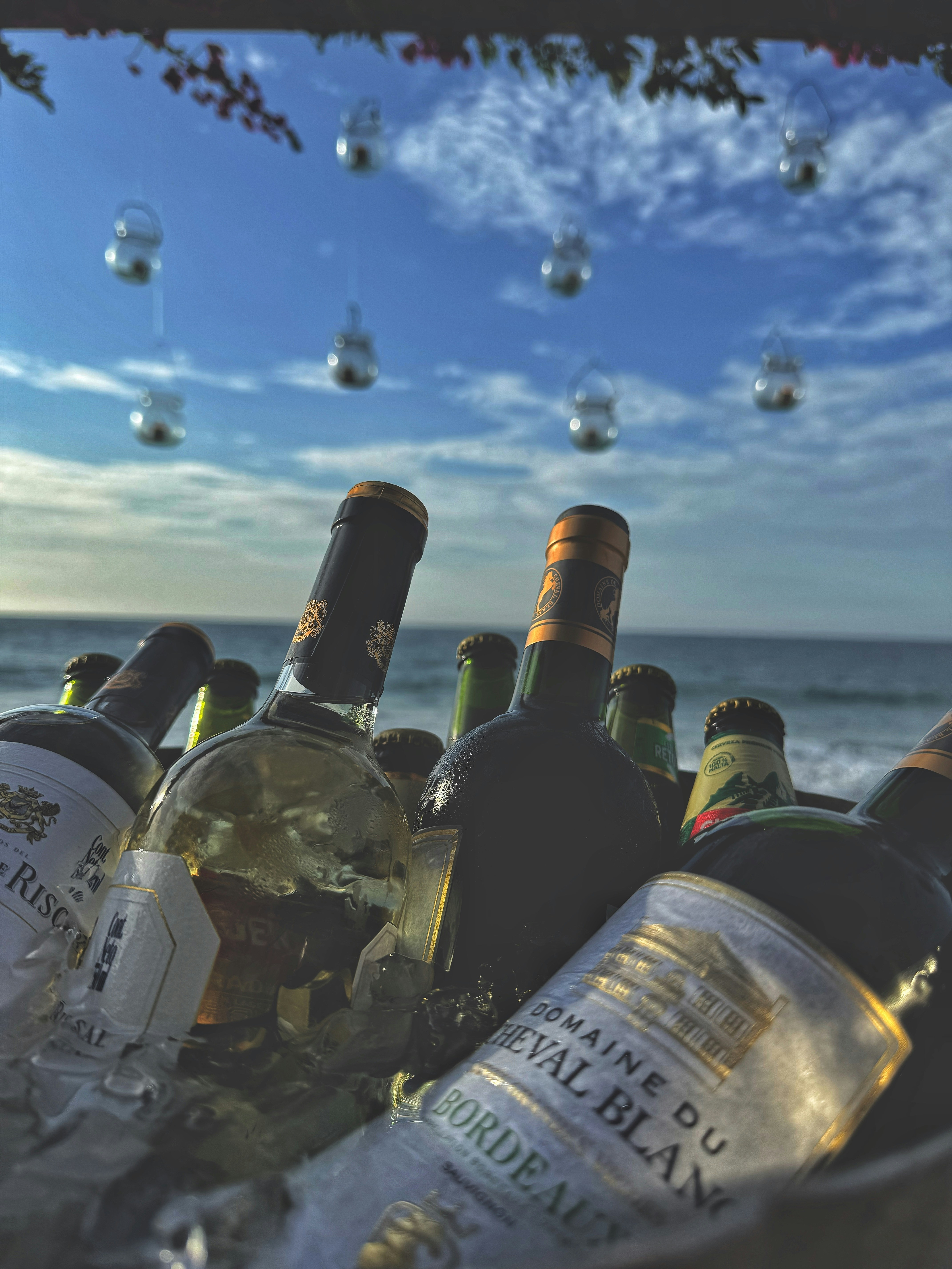 Beachbar Bottles: Ice, Sky, and Suspended Gondolas