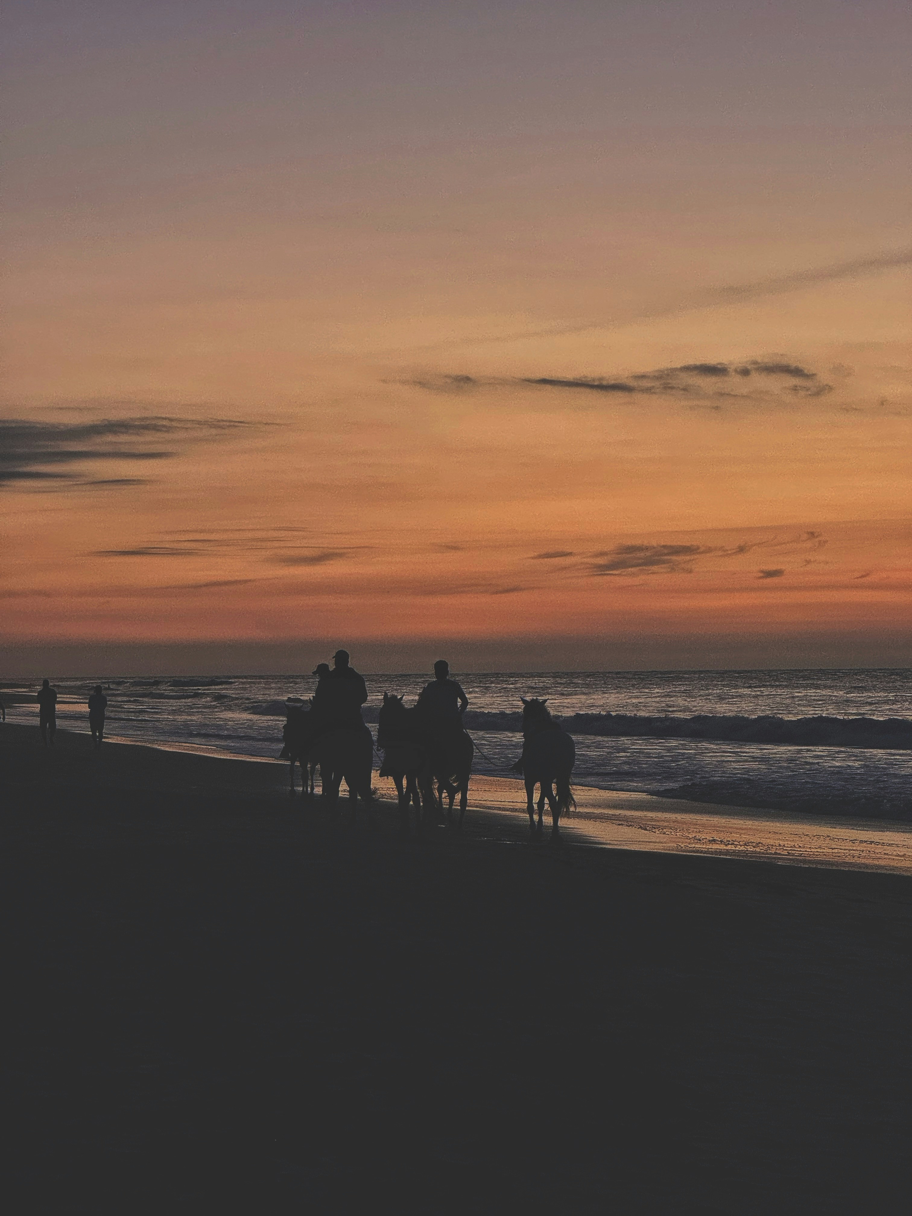 Silhouetted Beach Gathering at Dusk