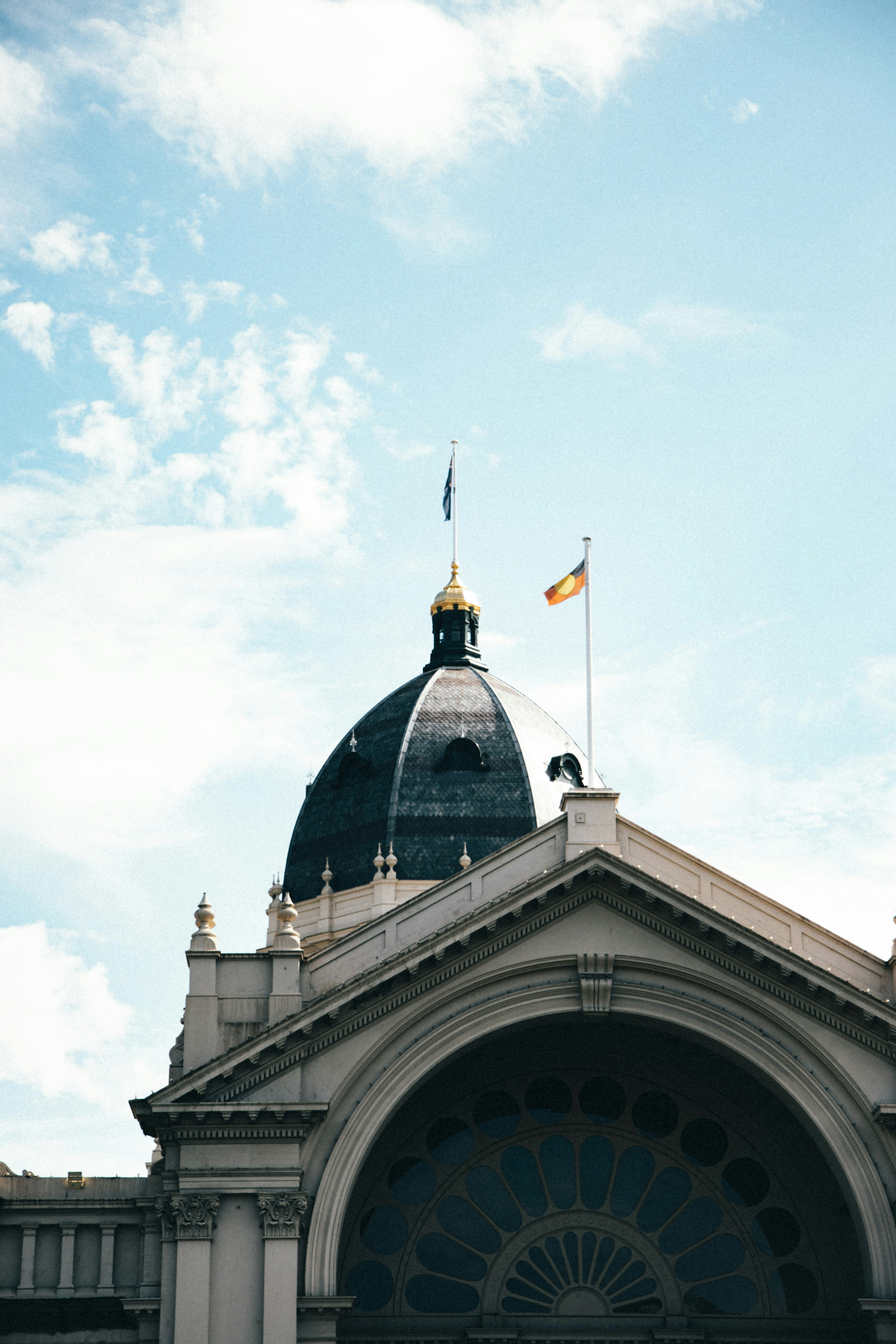 Domed Skyline: A Historic Facade Under a Widesky Blue