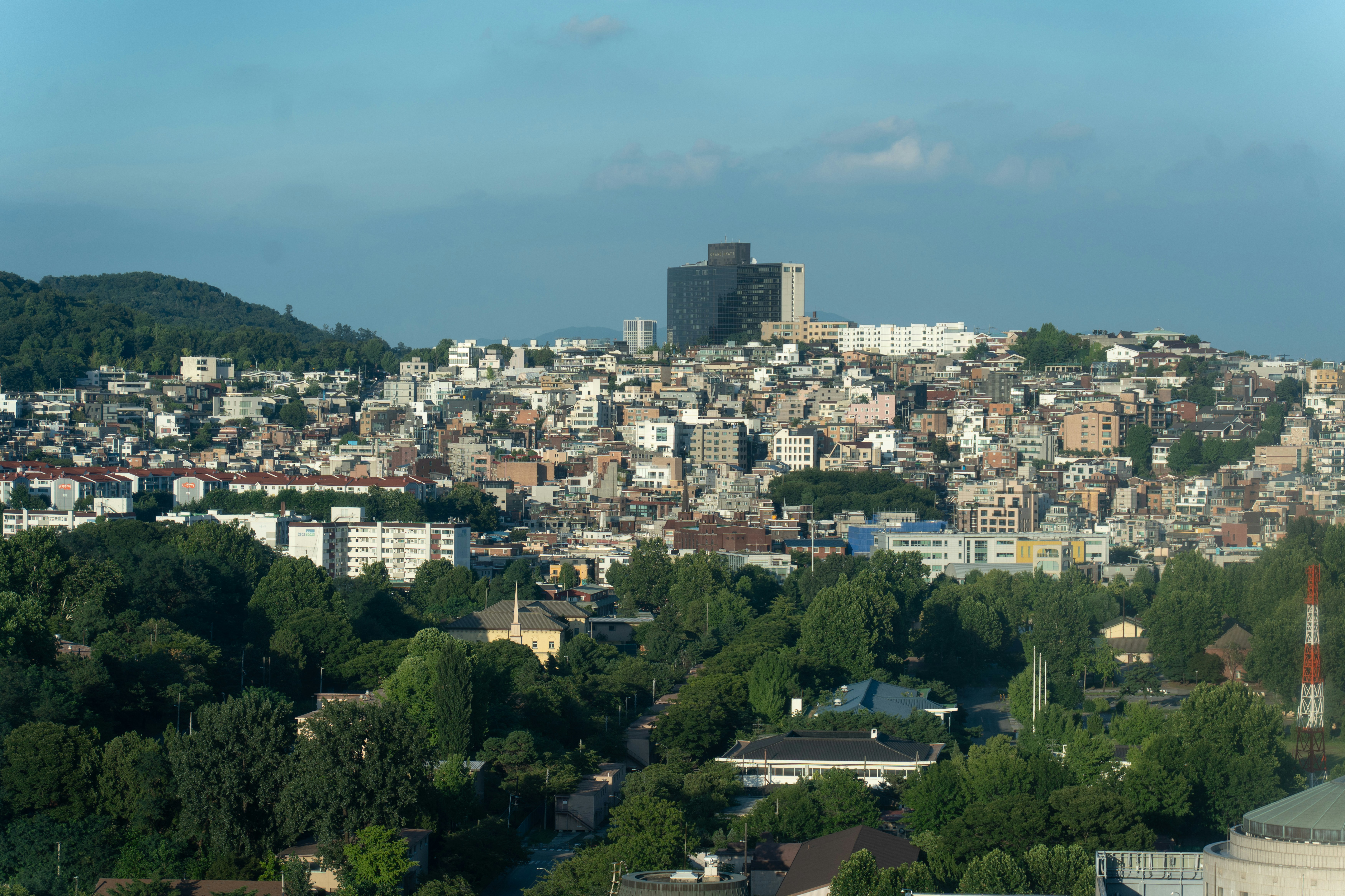 Urban Crest: A City Horizon Crowned by a Sloped Skyline