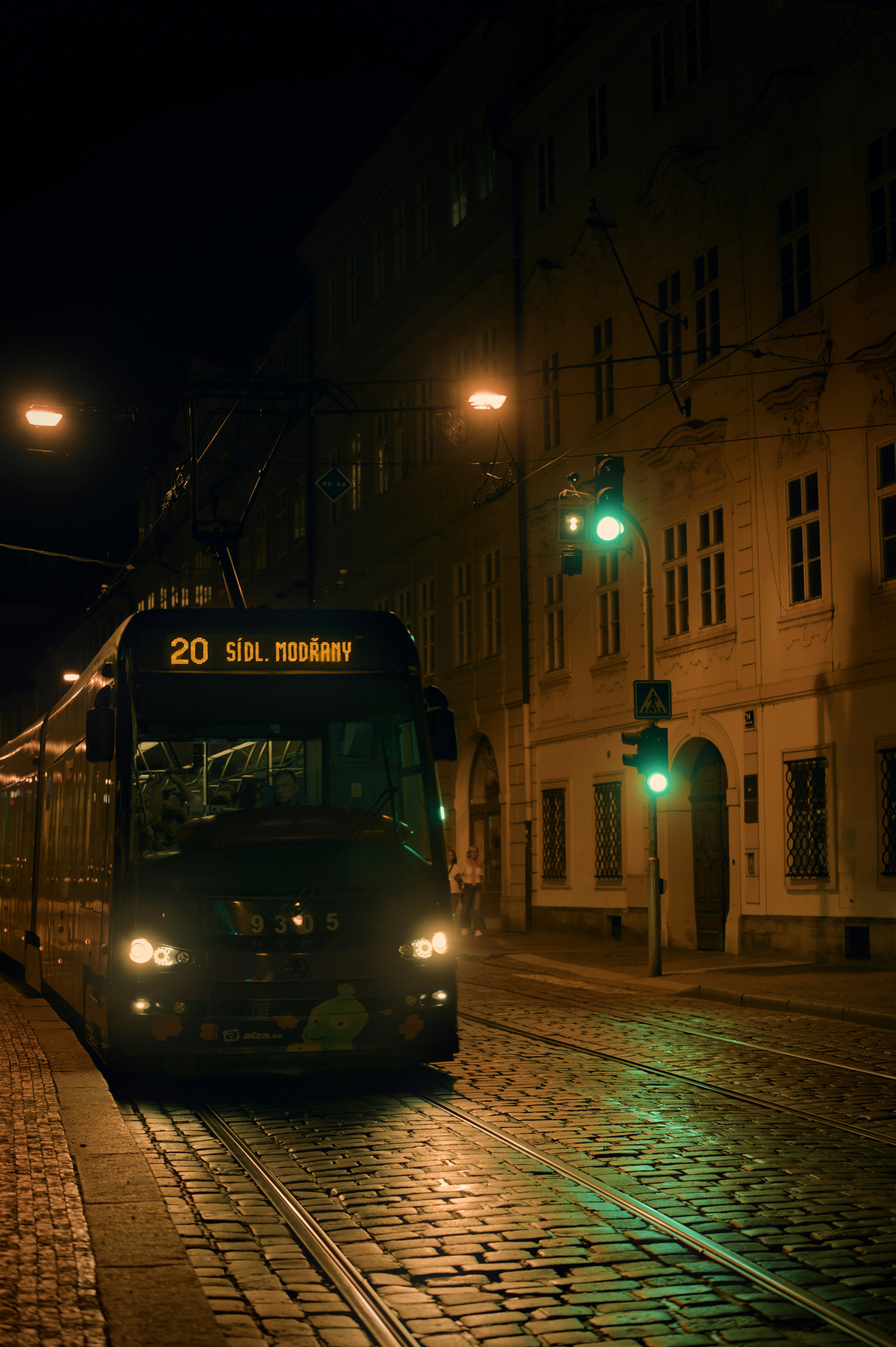 Nightbound Tram: Green Signals and Wet Cobblestones