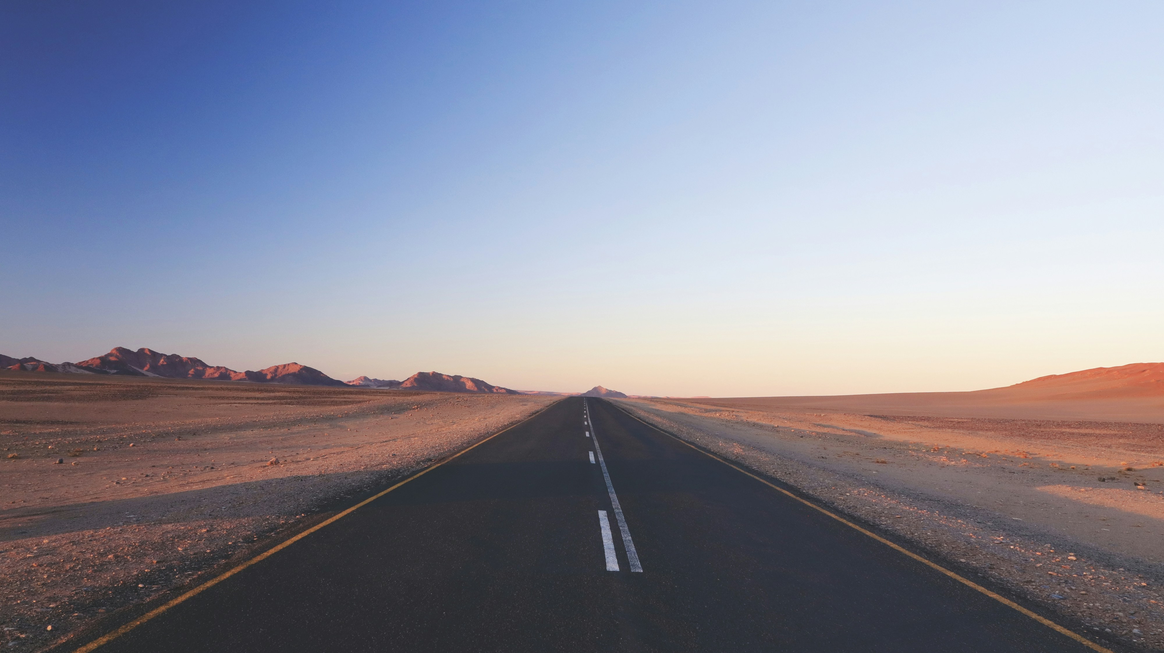 Endless Horizon: A Desert Highway Toward the Quiet Sunset