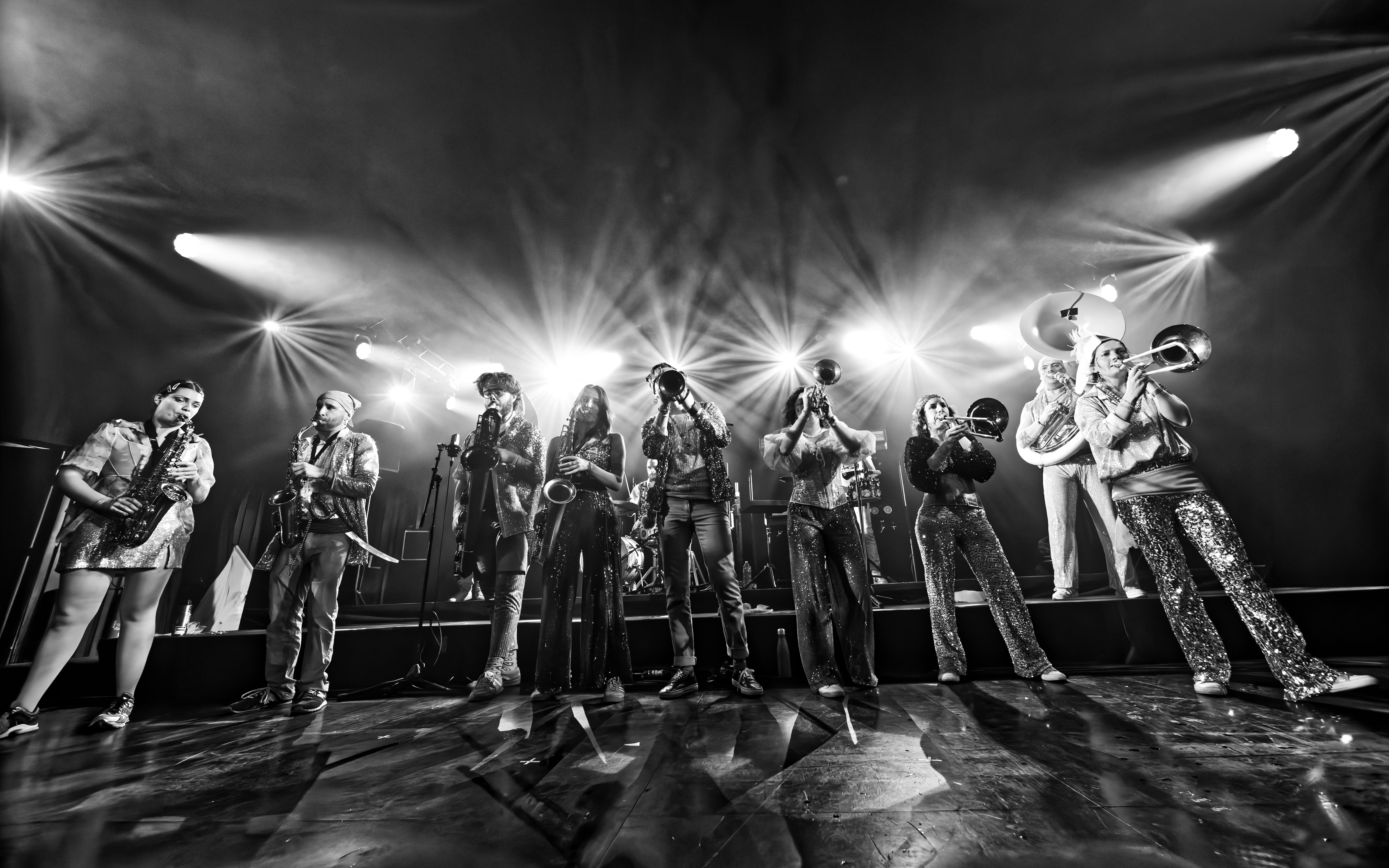 A Brassline at Center Stage: A Night of Neon and Noise