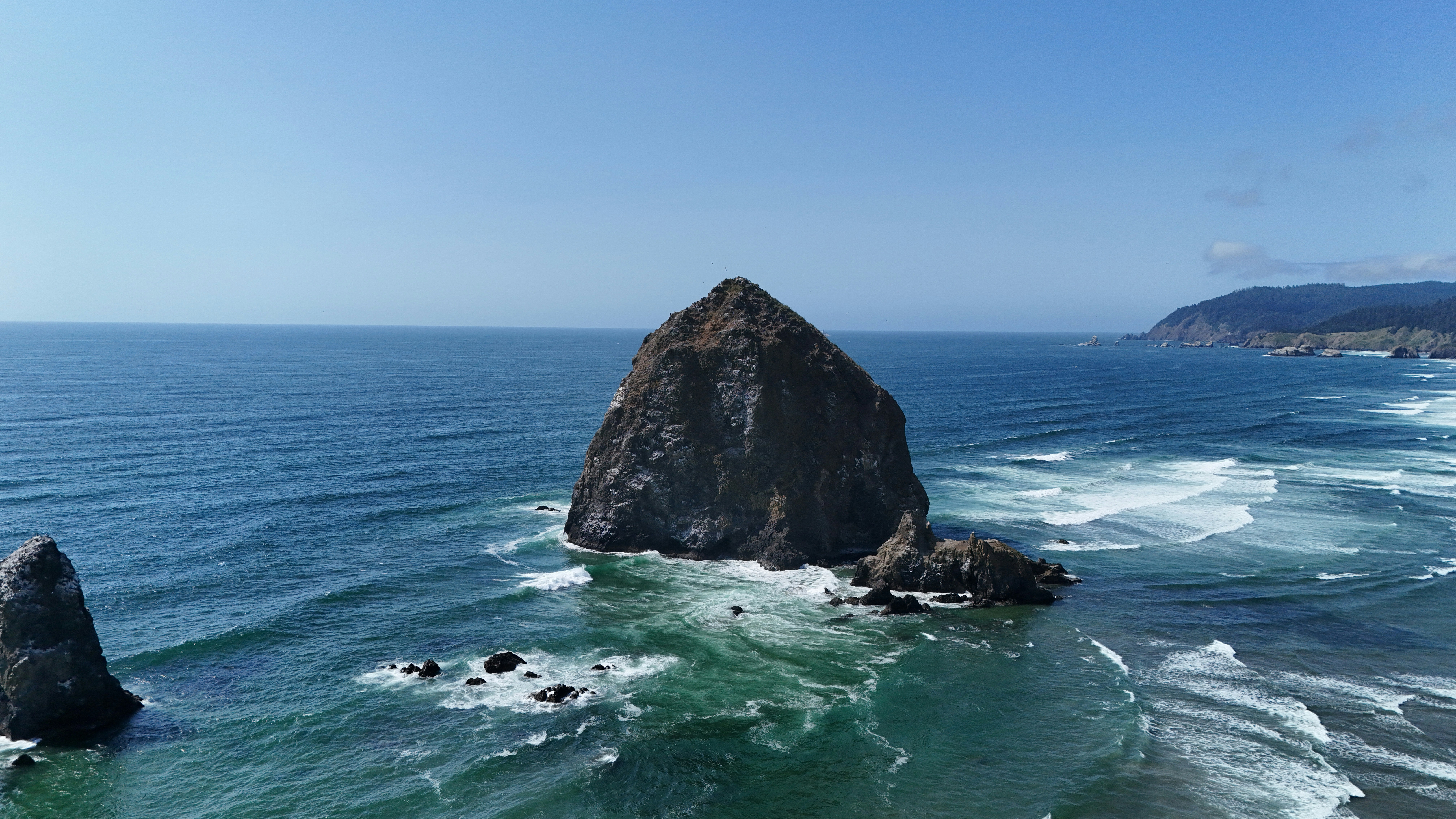 Sea Sentinel: The Lone Rock Guarding the Coastal Edge