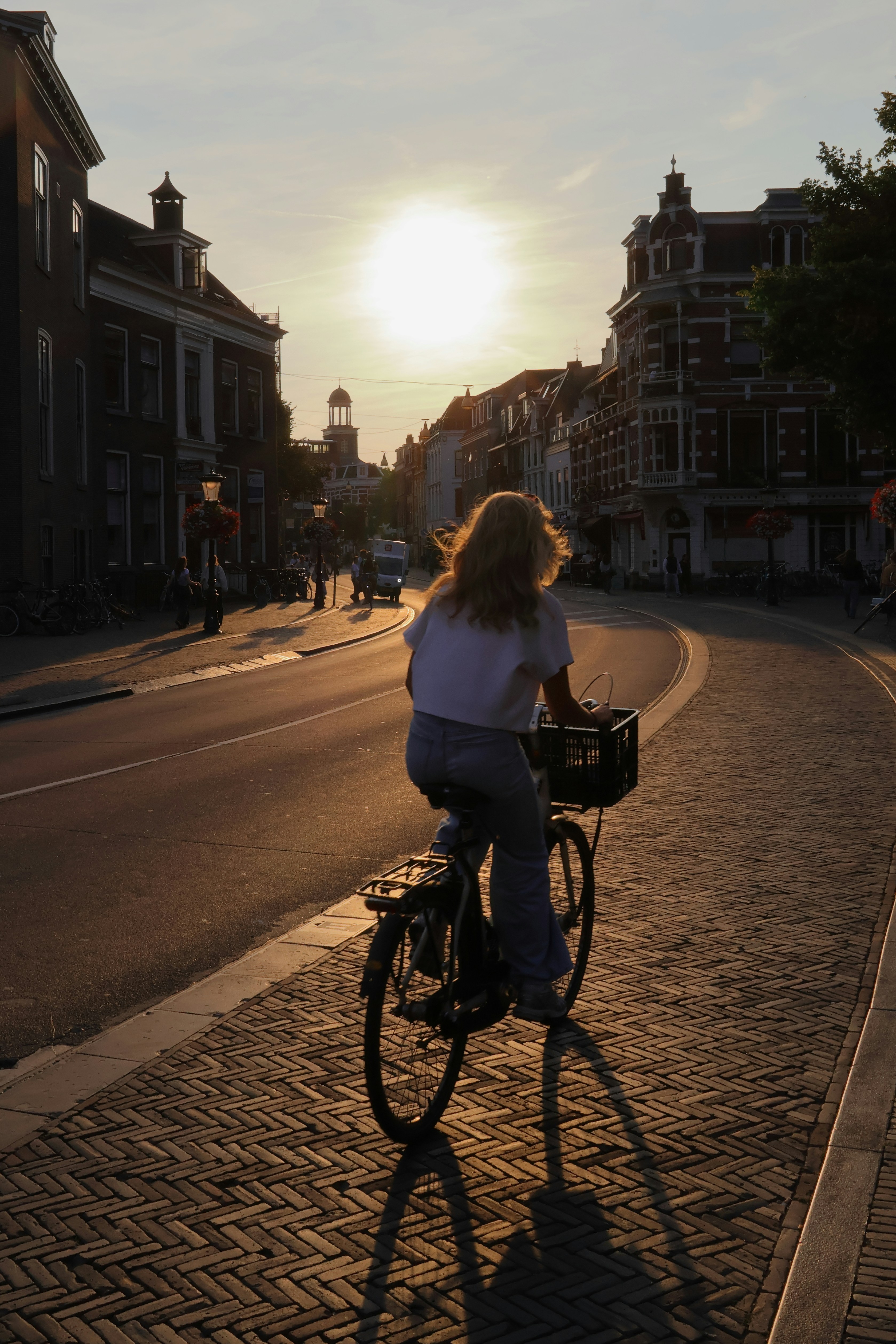 Golden Hour Cyclist: A Quiet Ride Through an Italian- esque Street