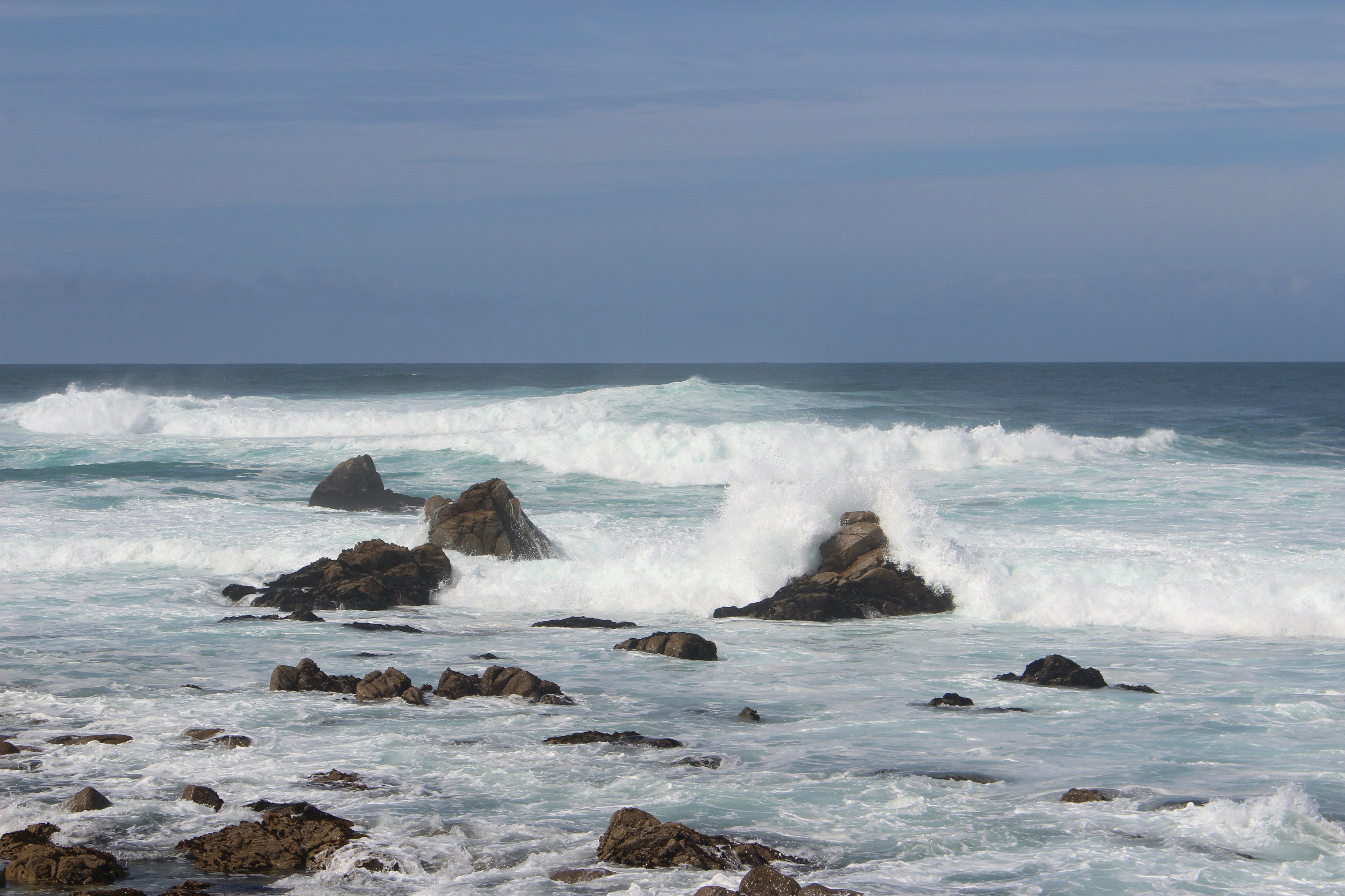 Breakers Over Rugged Reefs at Dusk